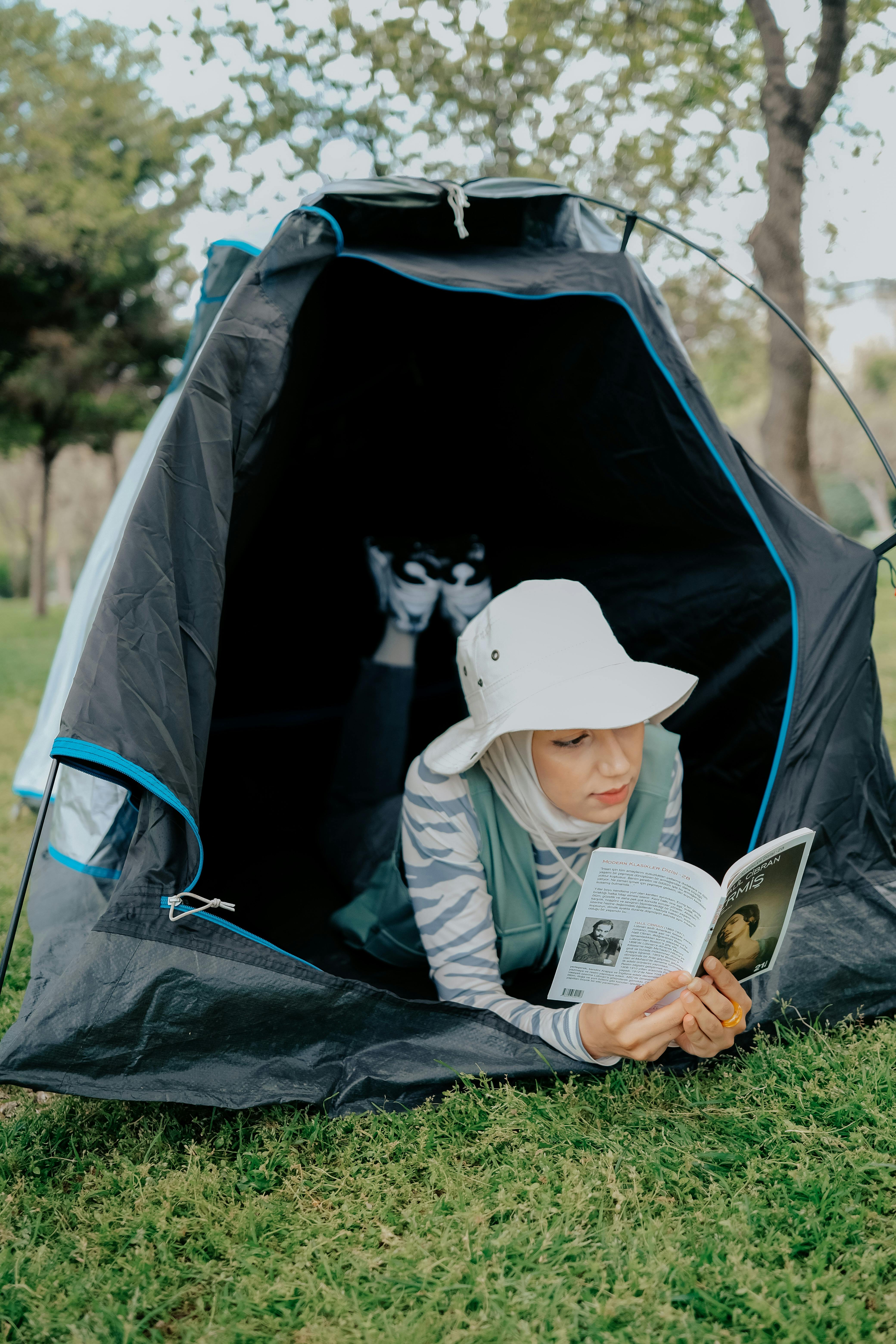 Woman Reading in Tent · Free Stock Photo
