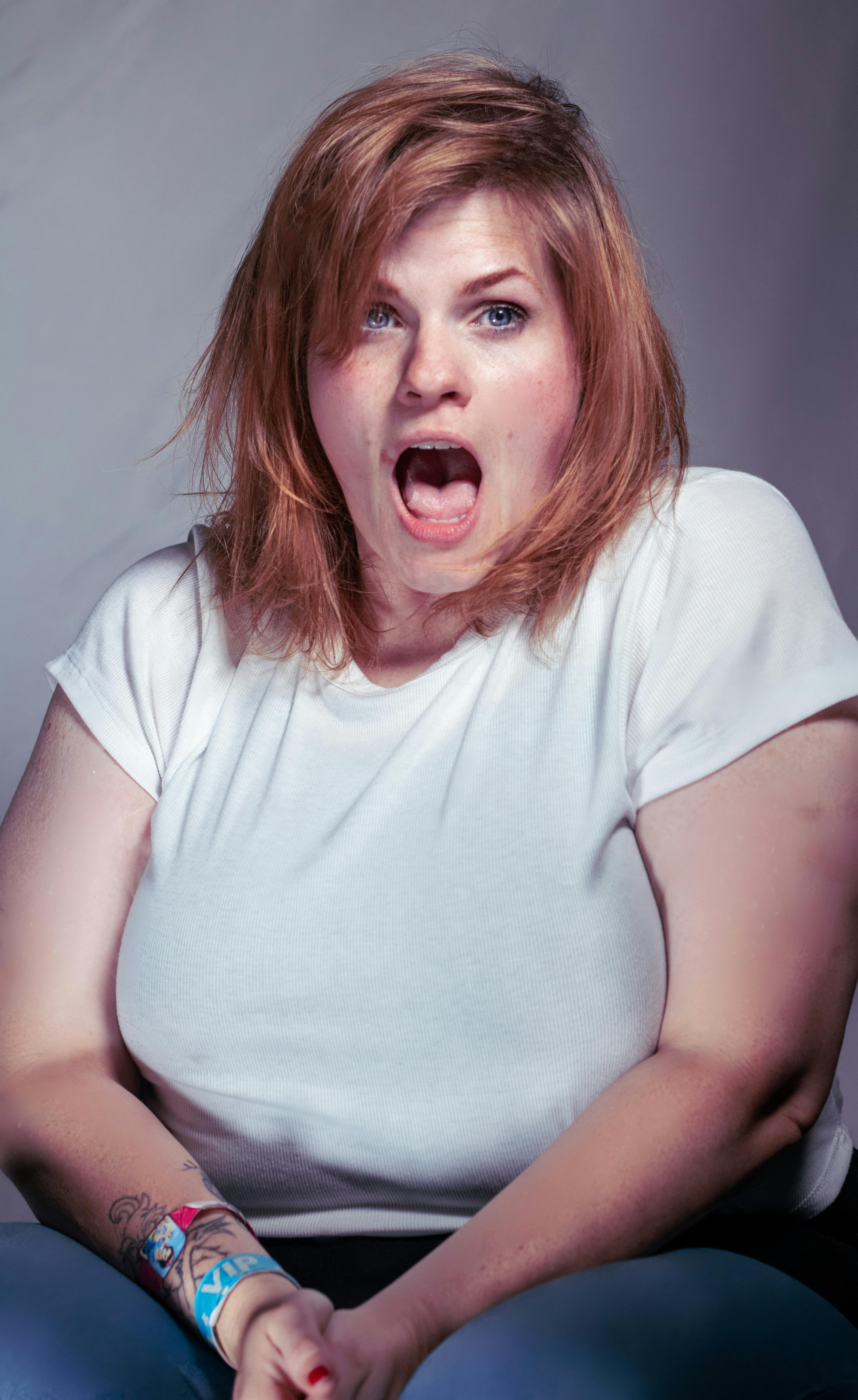 Young Woman Sitting and Screaming · Free Stock Photo