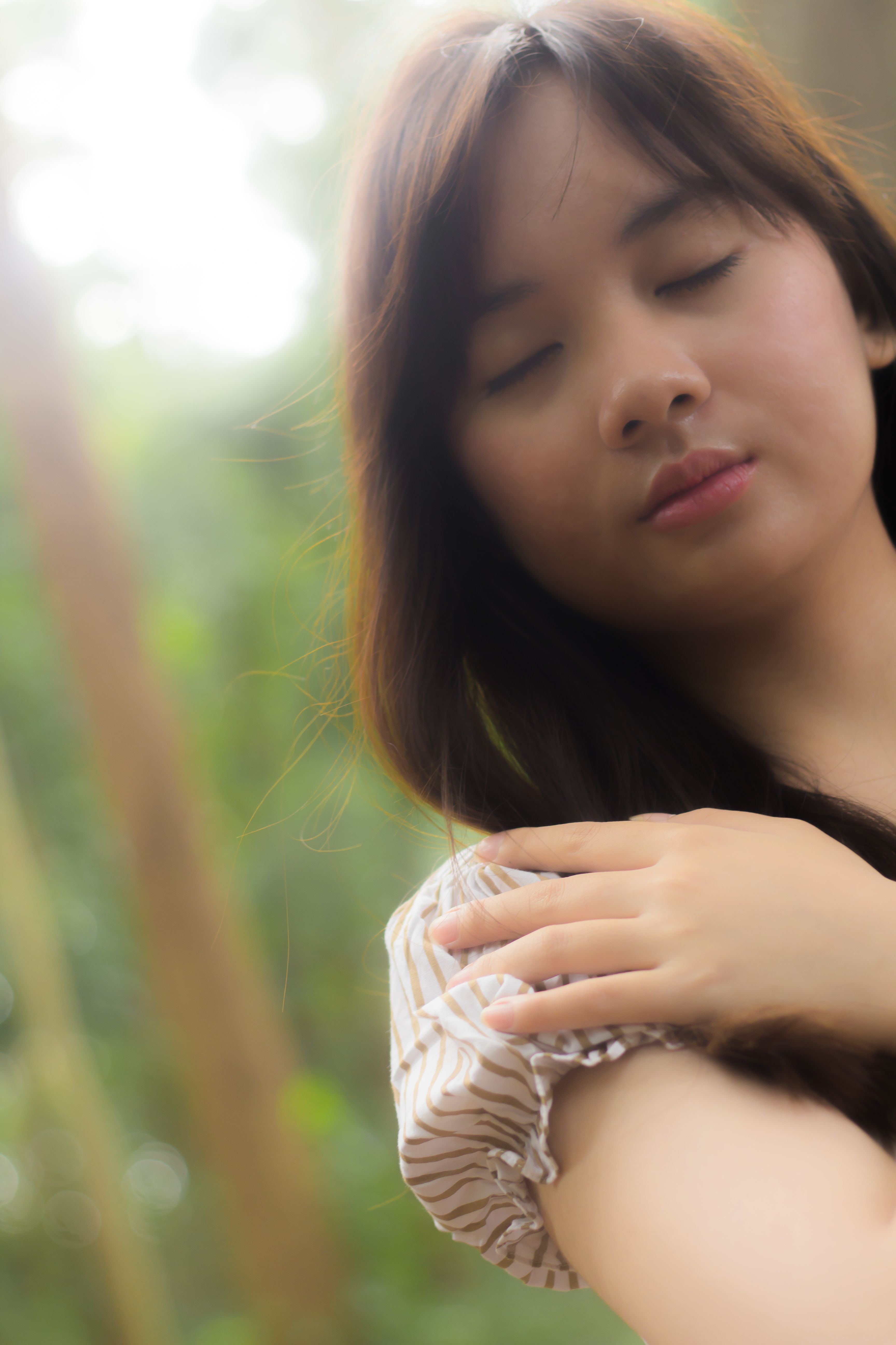 Woman Touching Arm with Hand · Free Stock Photo
