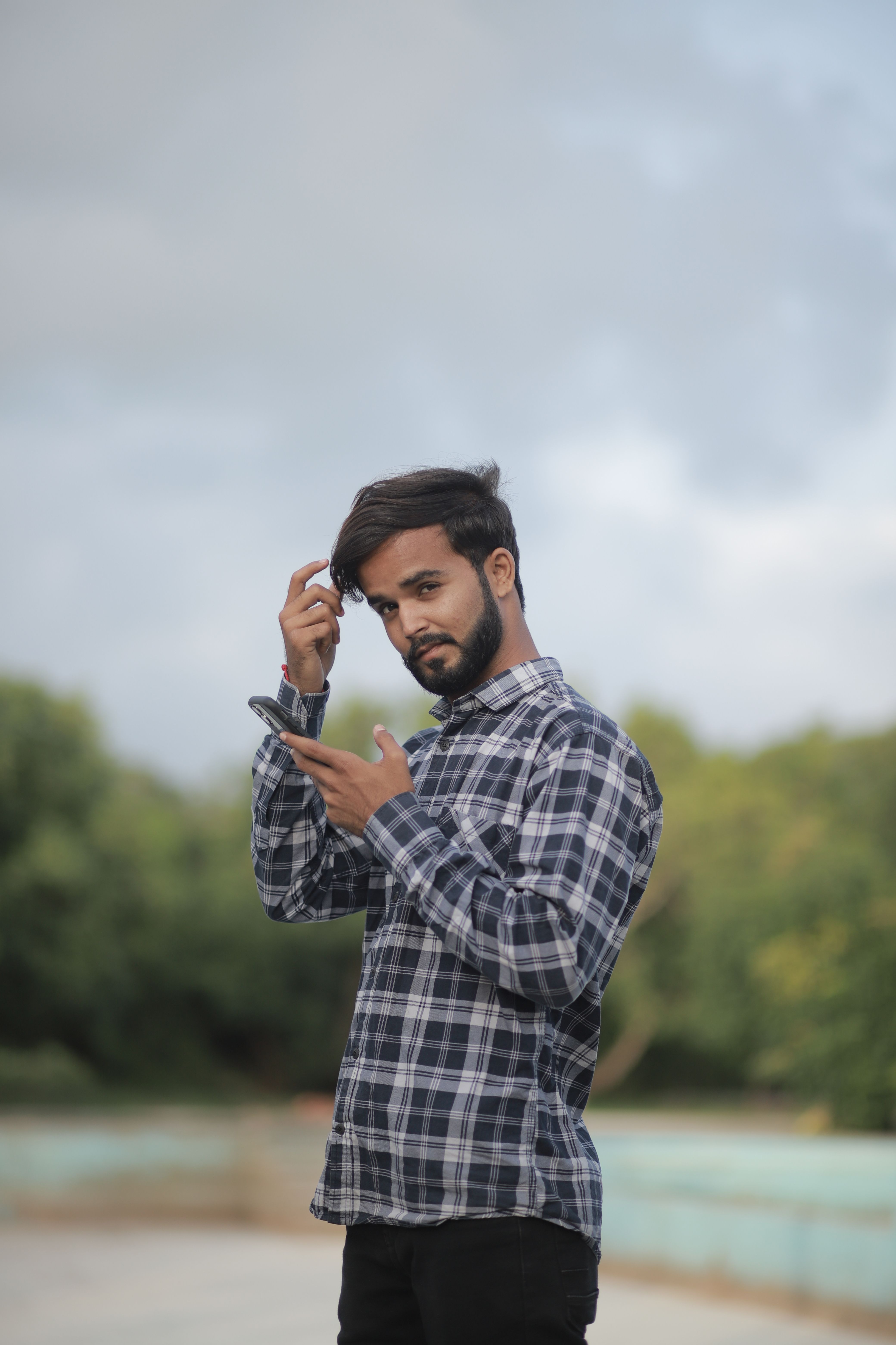 A Portrait of a Man Wearing Checkered Shirt · Free Stock Photo