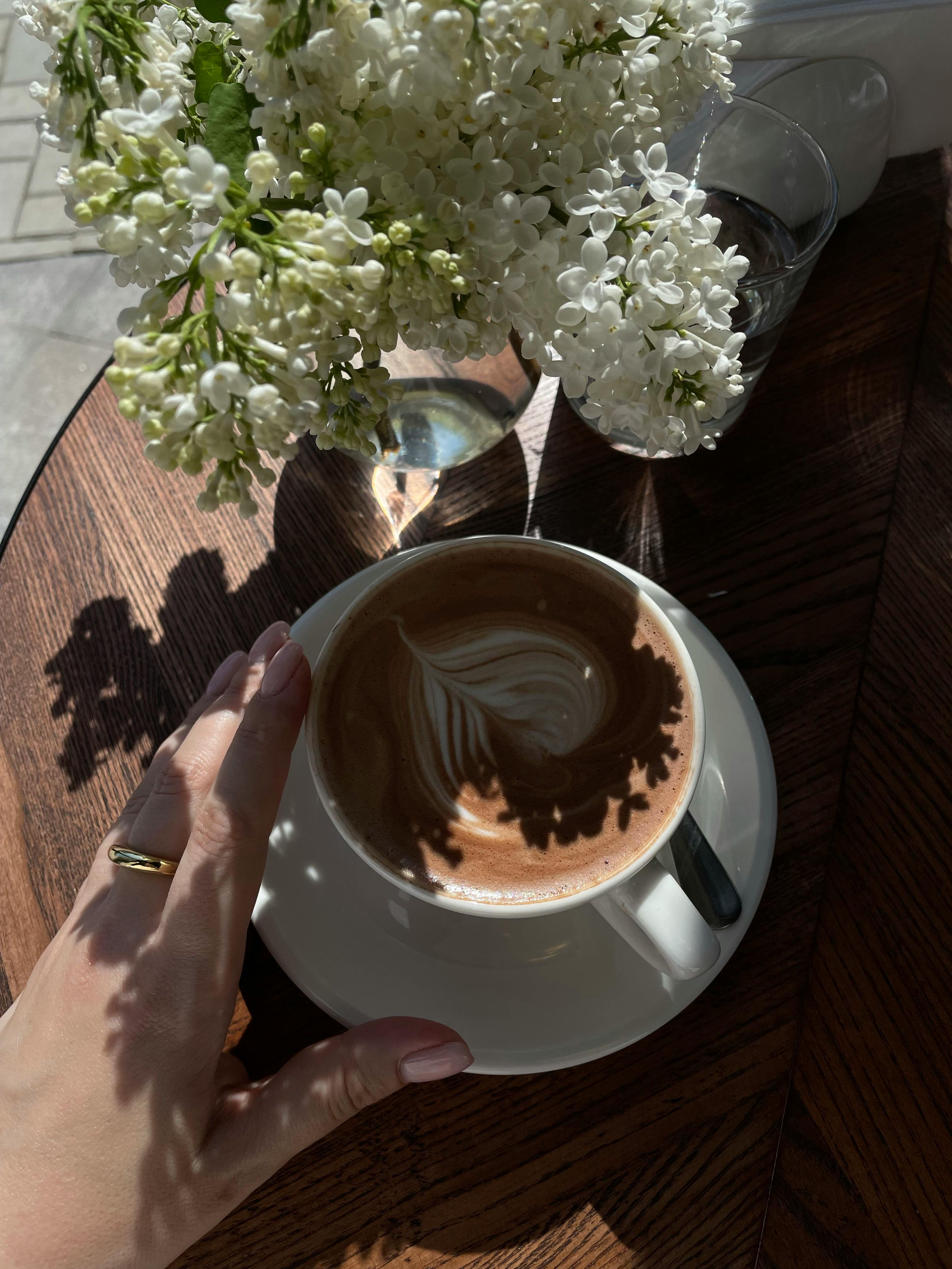 Woman Hand over Coffee Cup · Free Stock Photo