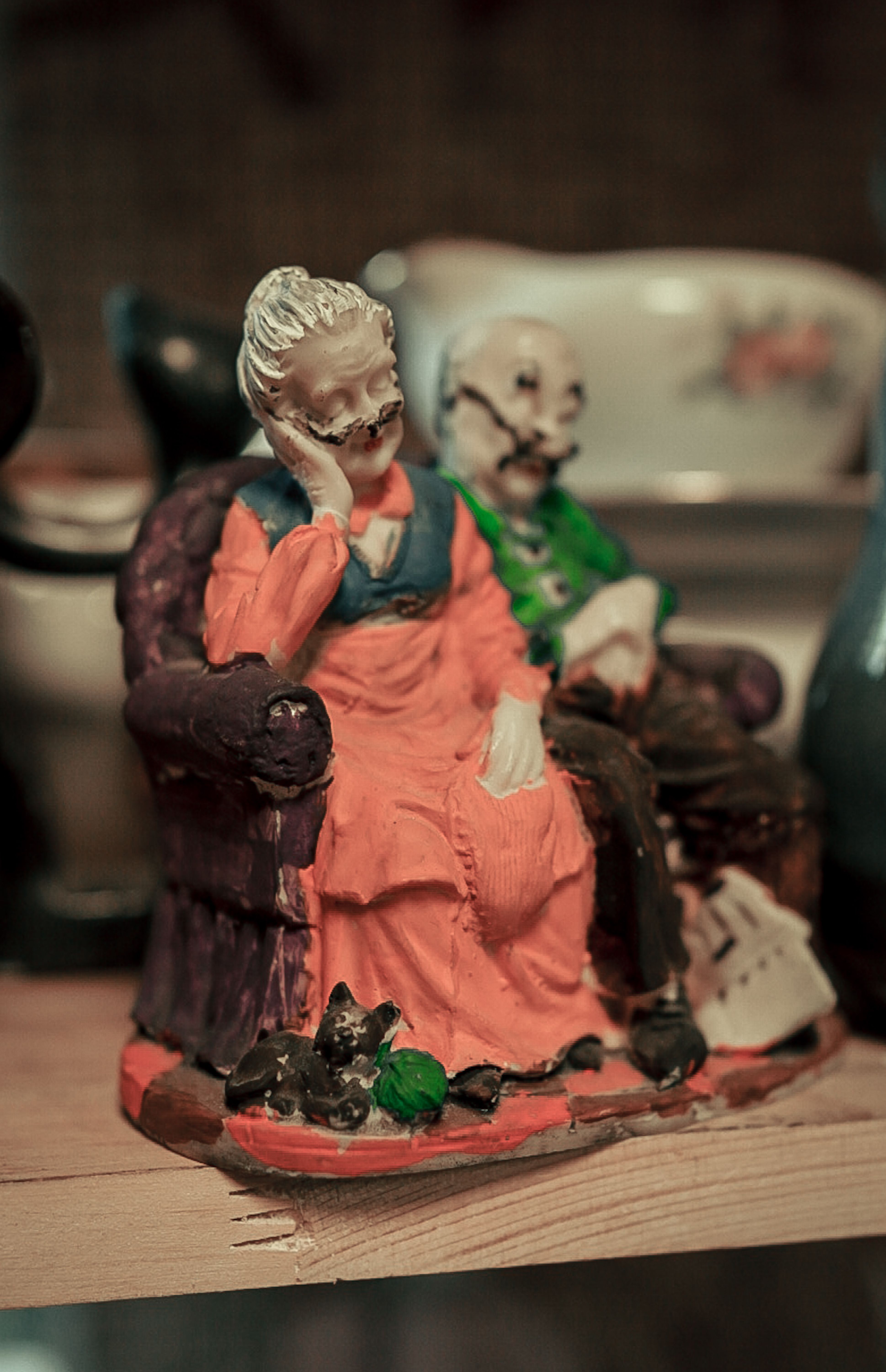 Hand Painted Figurine of Old Lady Sleeping in Chair · Free Stock Photo