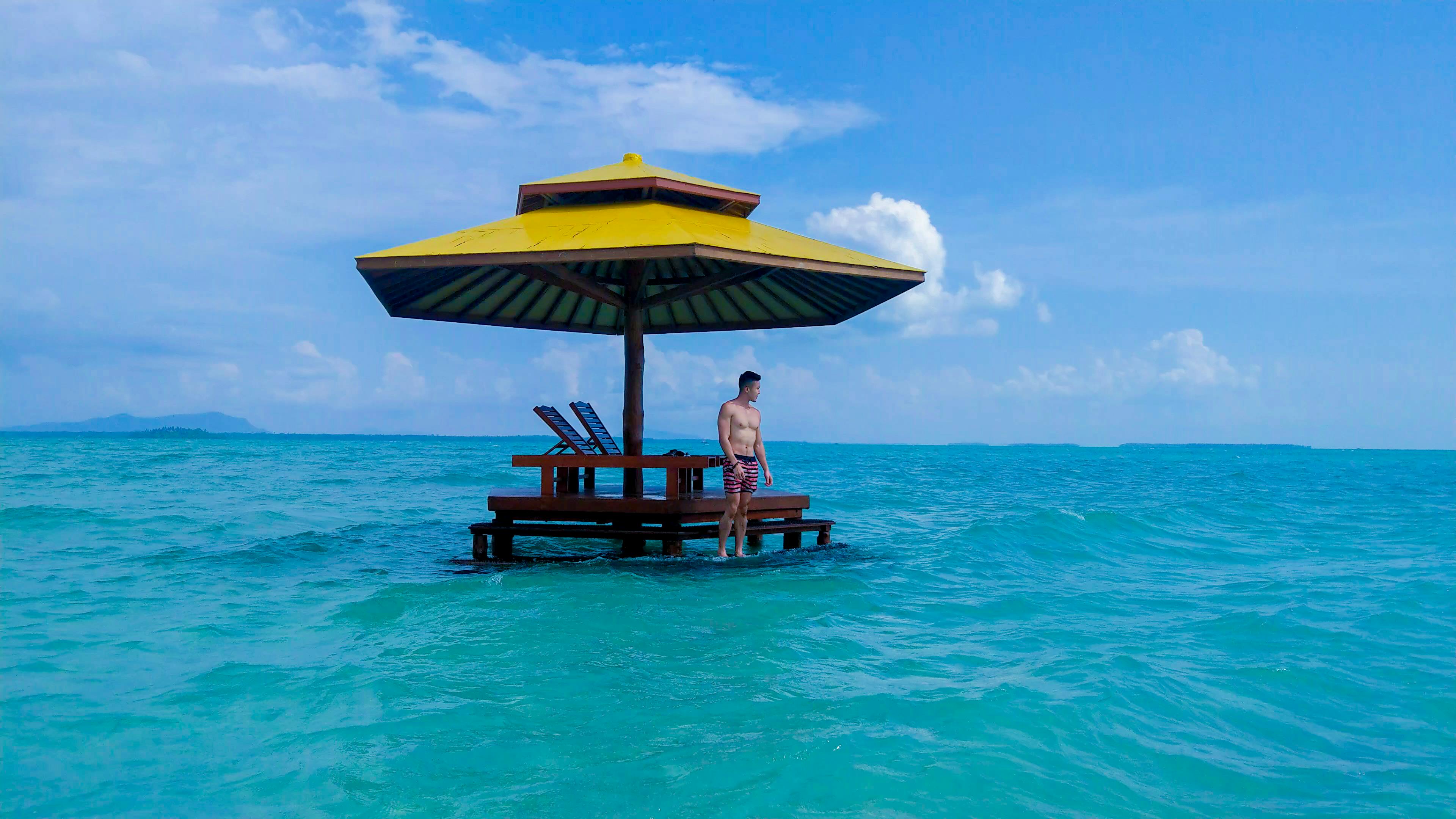 People Near Beach With Lifeguard Gazebo · Free Stock Photo