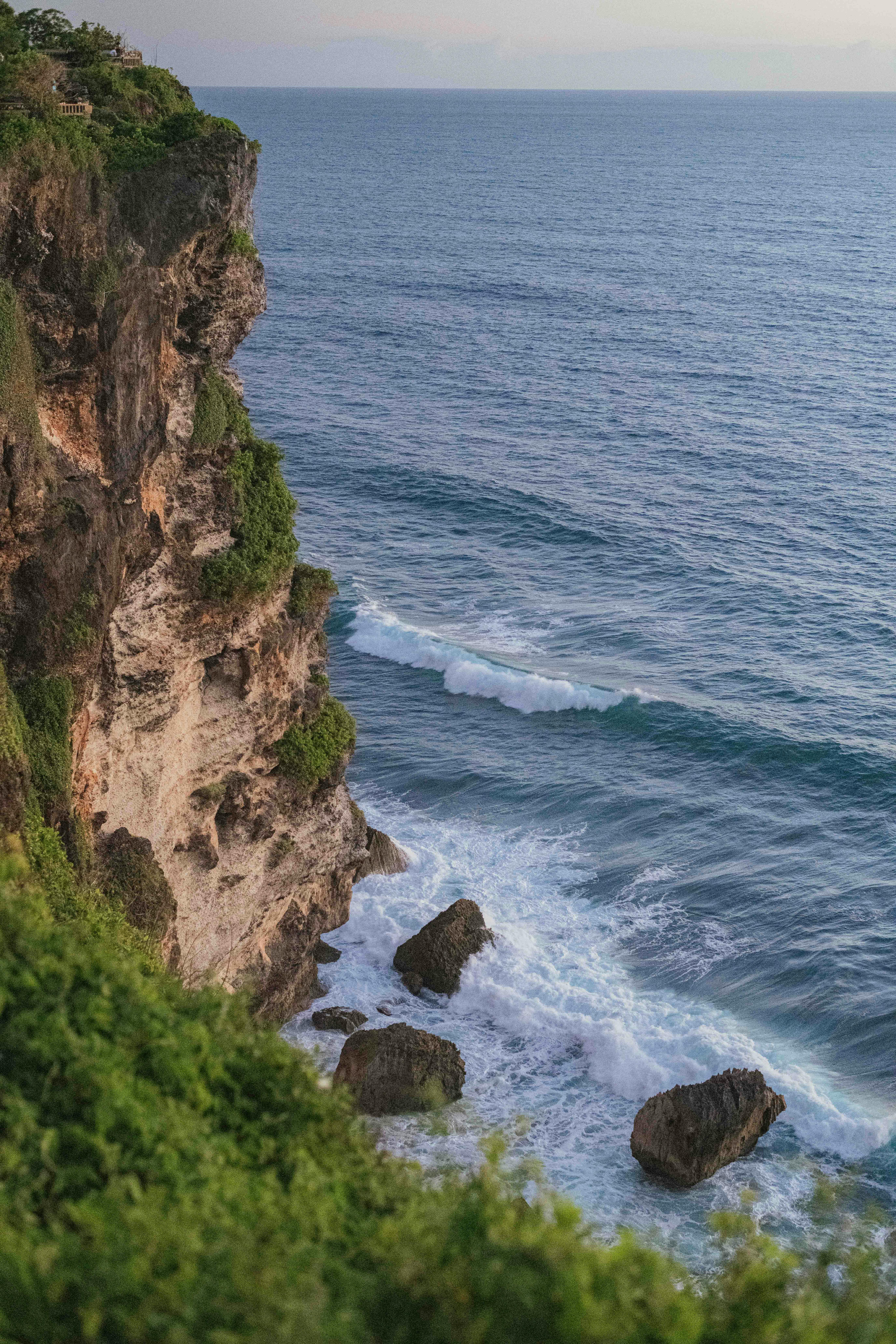 Waves Crashing Against a Rocky Cliff · Free Stock Photo