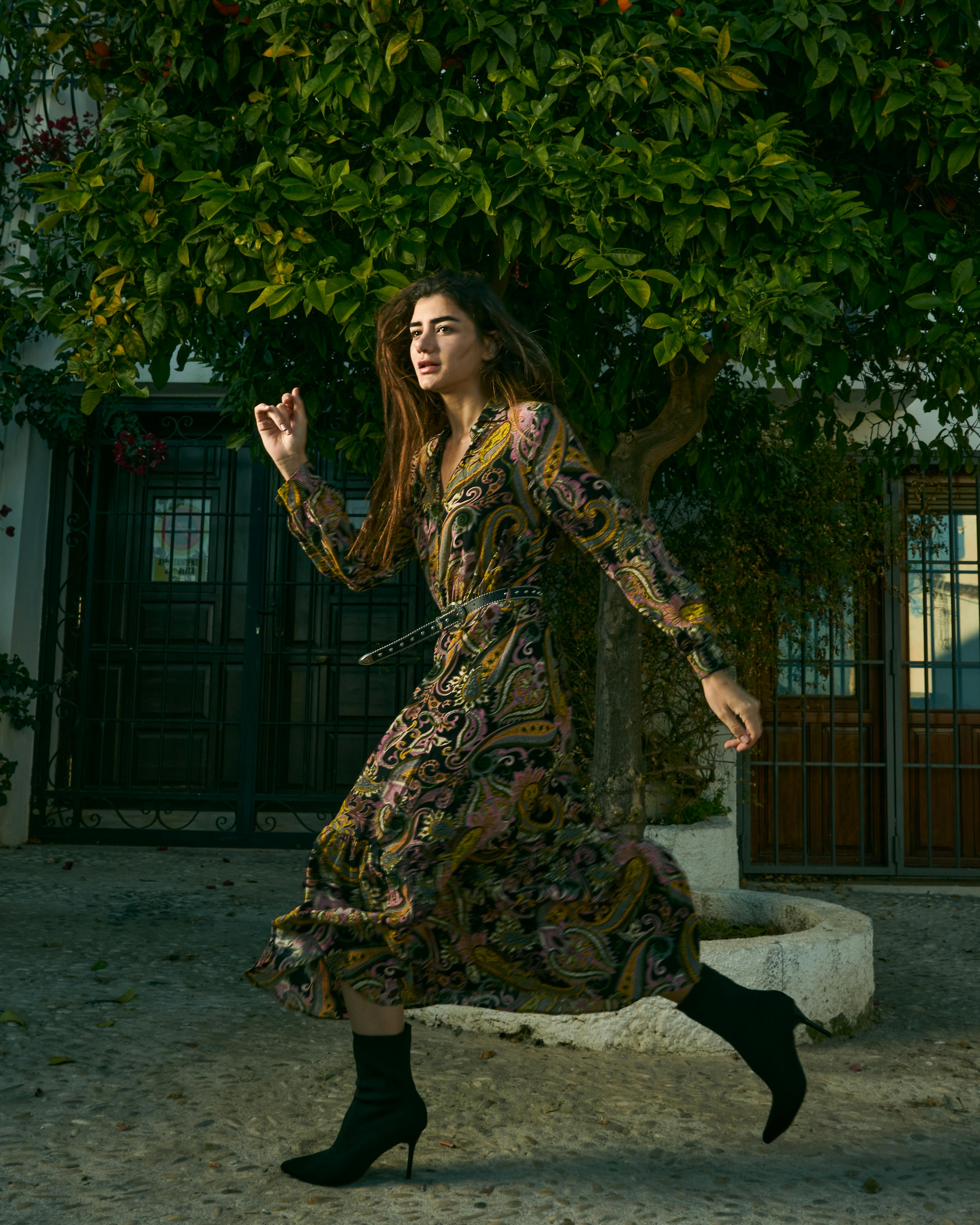 Woman in Sundress and High Heels Running in Town · Free Stock Photo