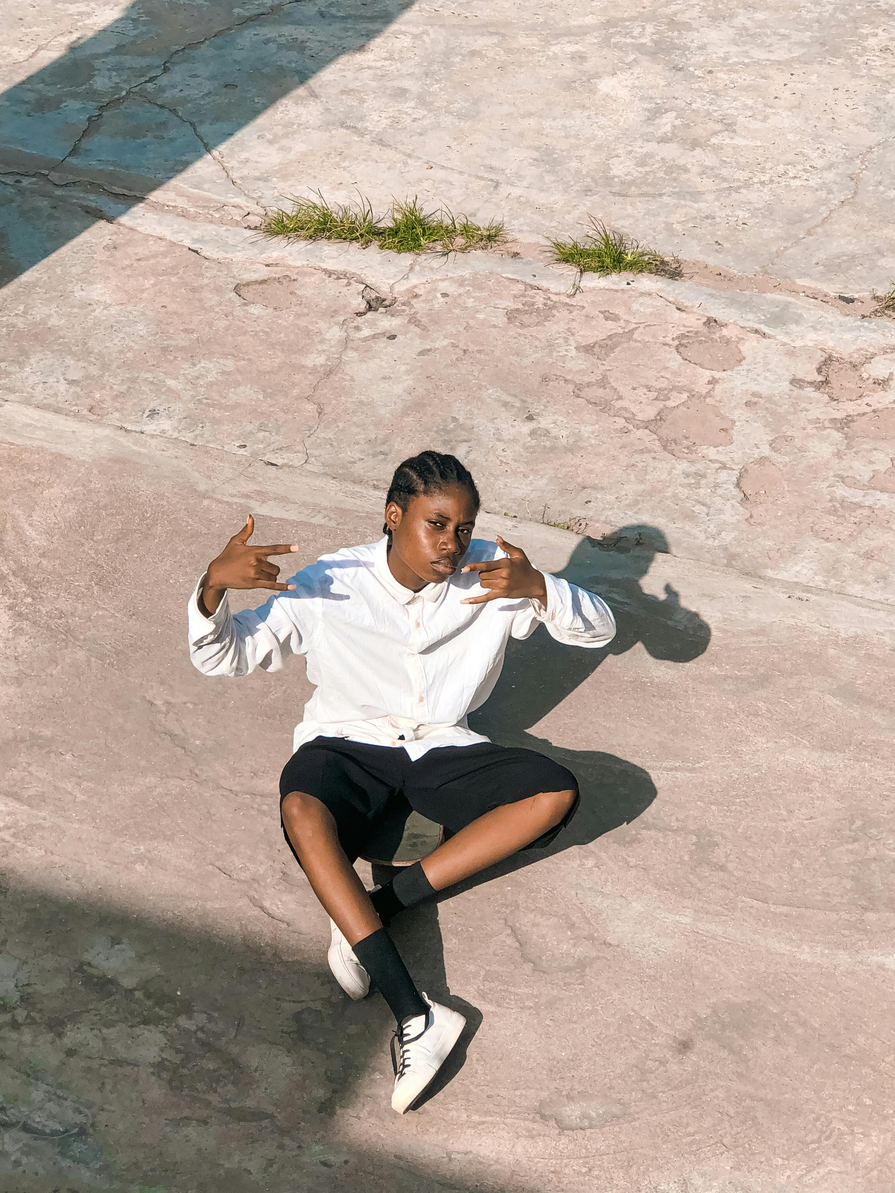 Rapper Making Yes Hand Gesture · Free Stock Photo