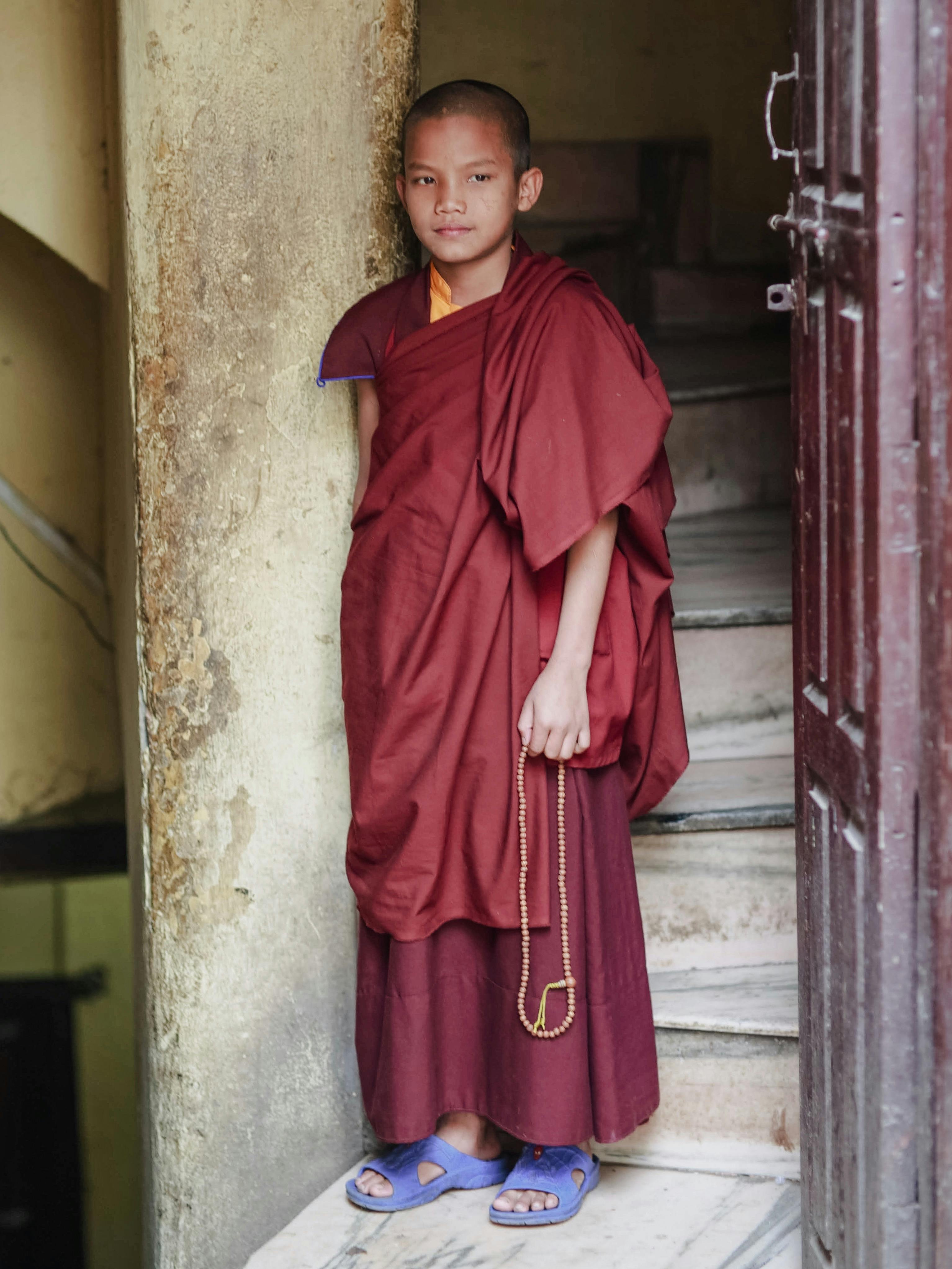 A Monk Wearing Brown Kāṣāya Smiling · Free Stock Photo