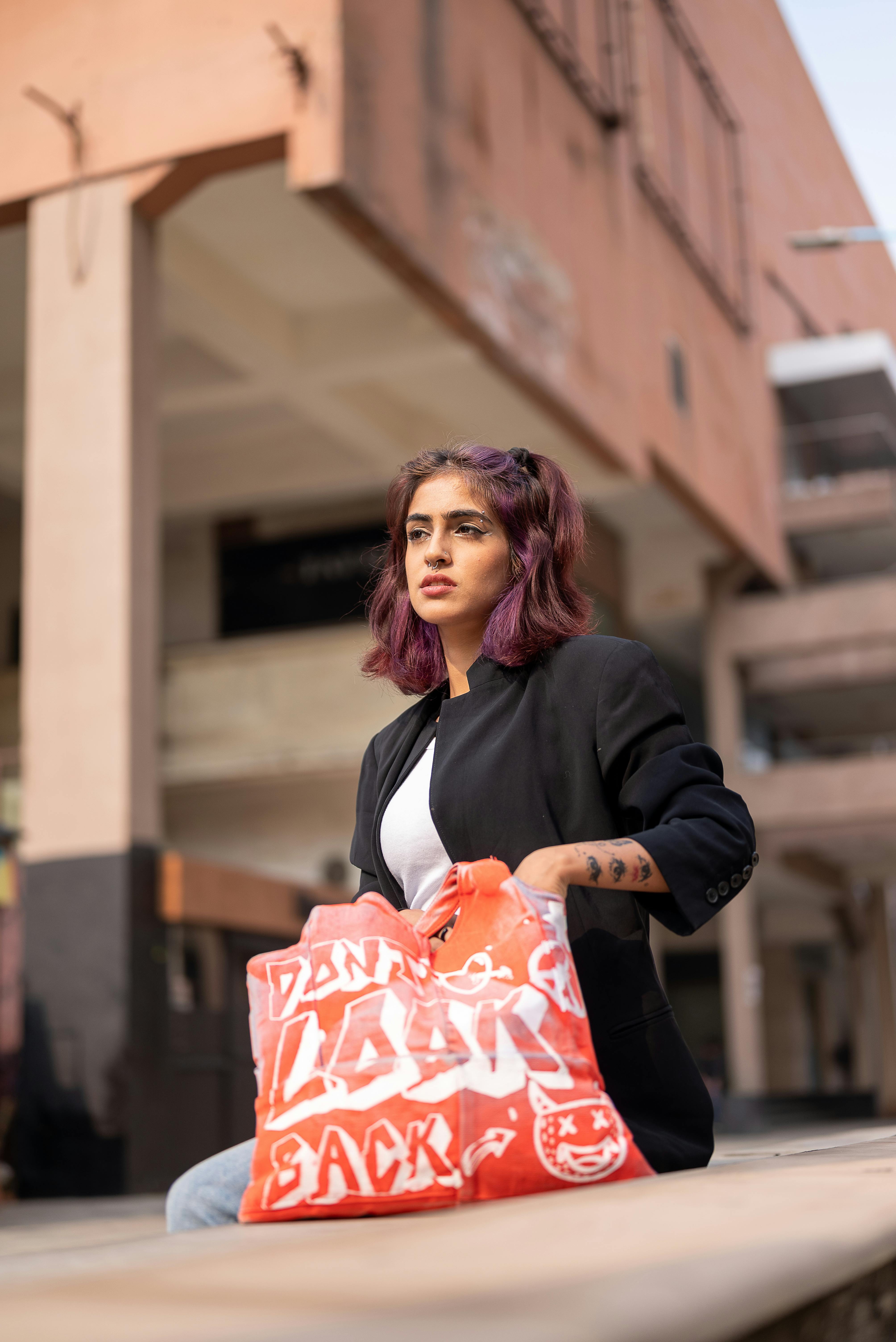 A Woman with a Tote Bag on the Street · Free Stock Photo