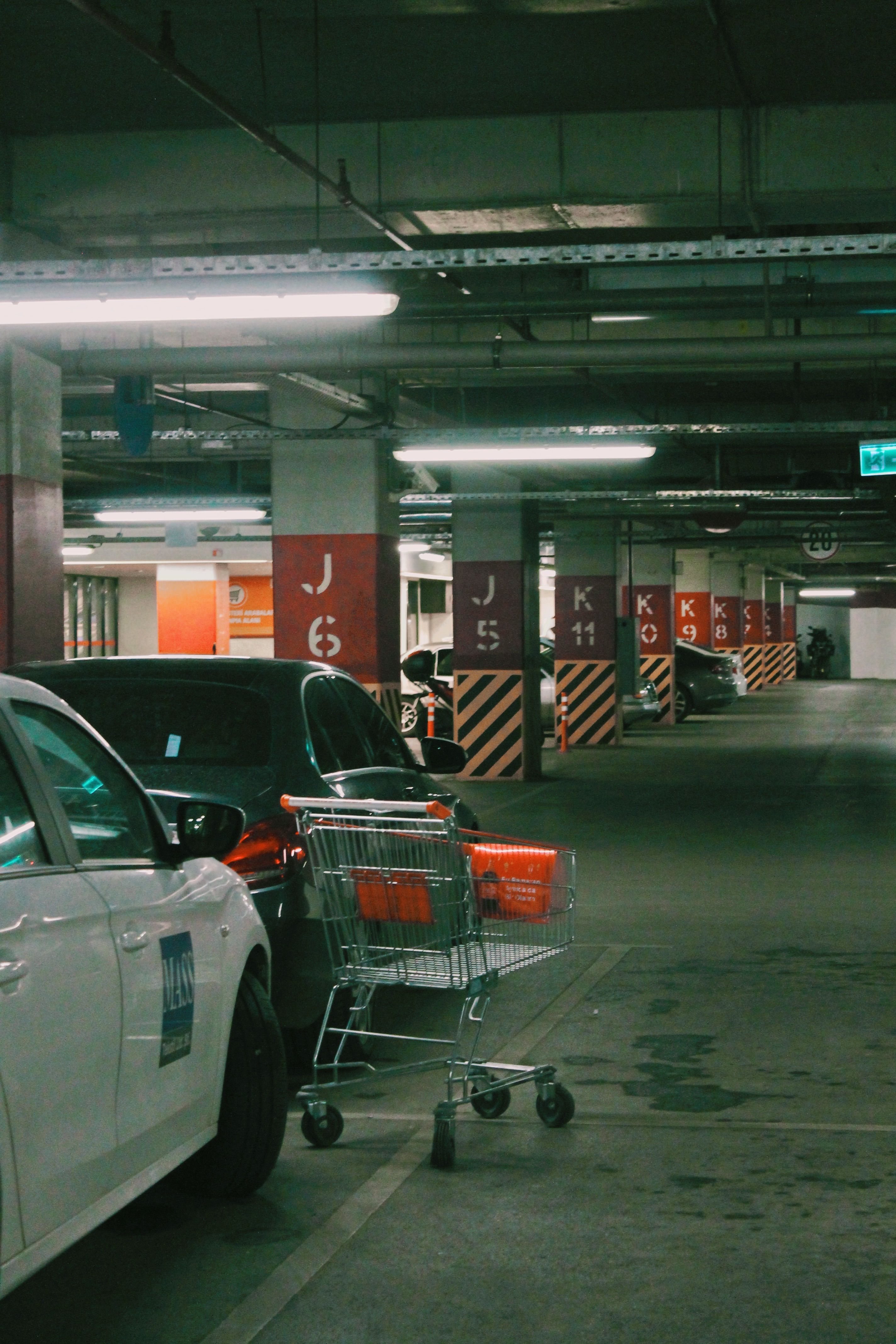 Vehicles Parked Inside Elevated Parking Lot · Free Stock Photo