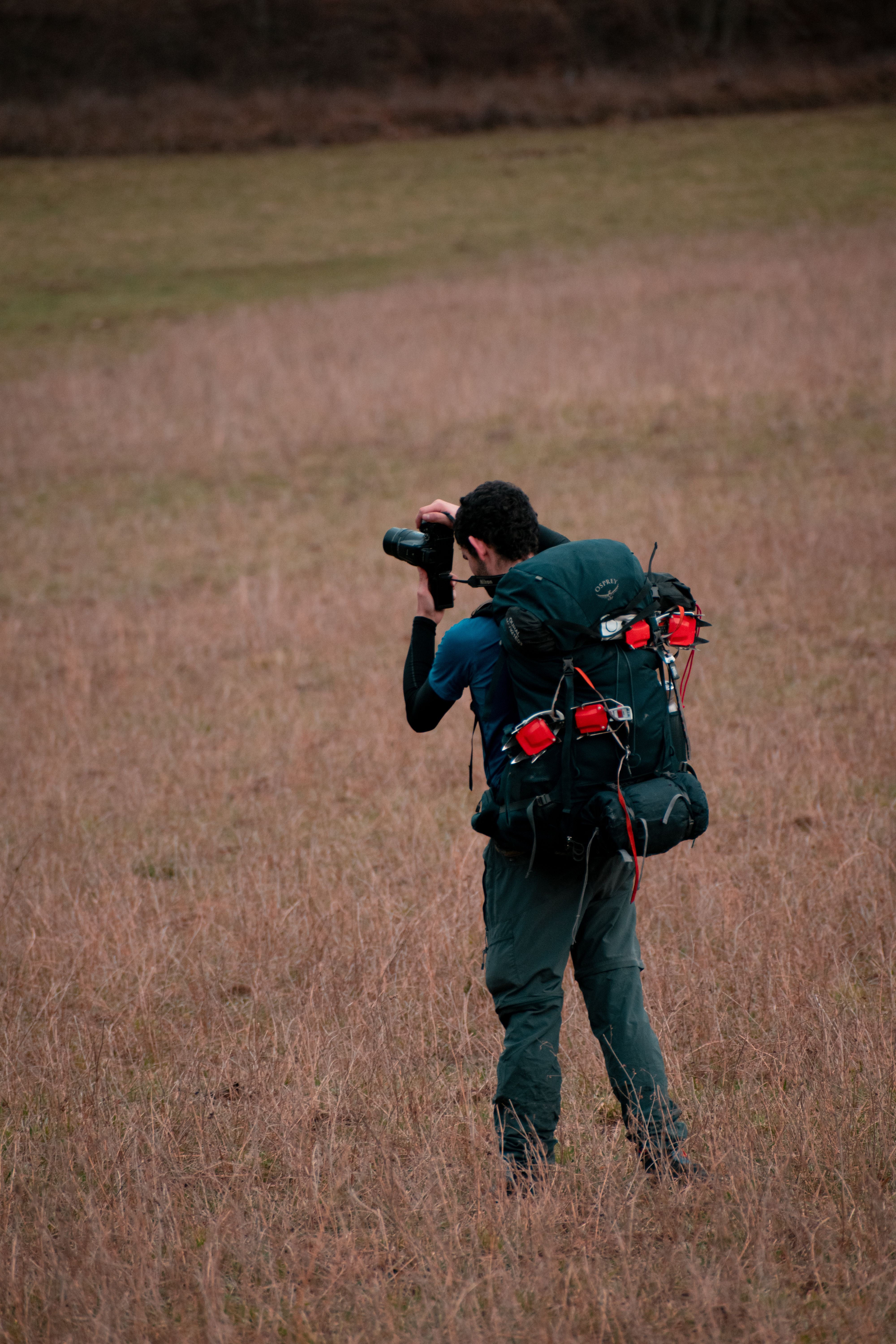 Man with Backpack and Camera · Free Stock Photo