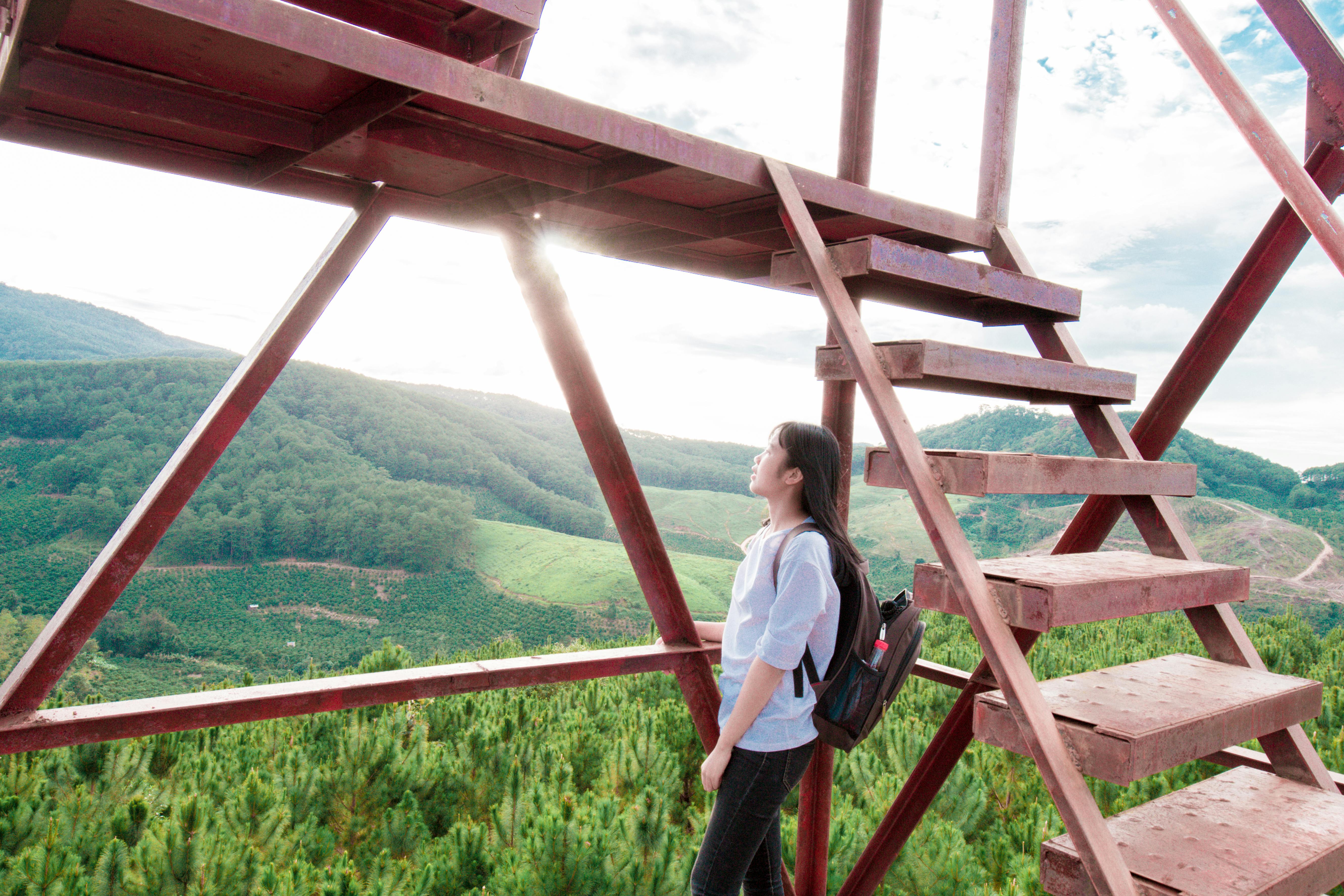 Person Leaning Against on Railing · Free Stock Photo