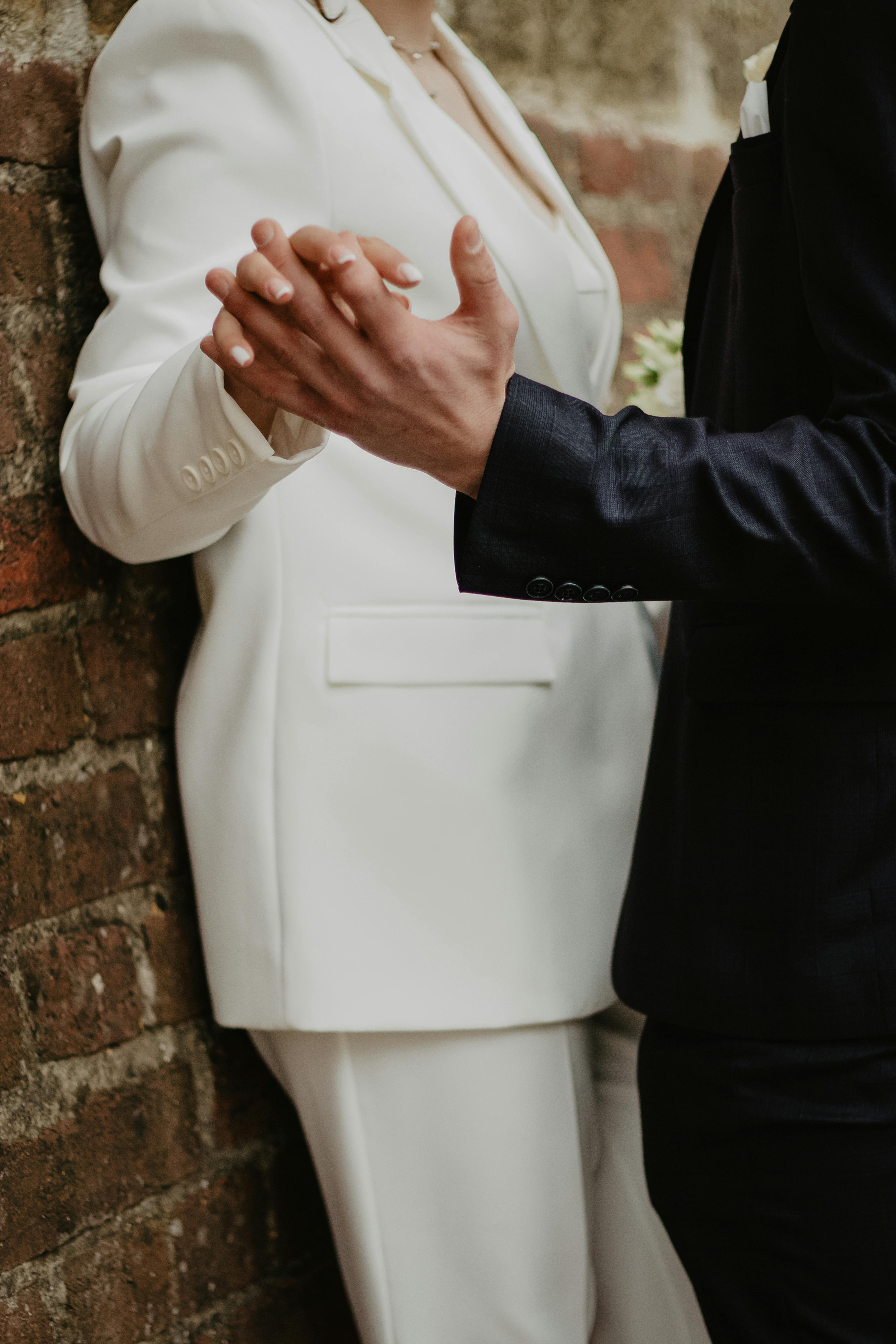Hands of a Young Couple with their Little Fingers Interlinked · Free ...