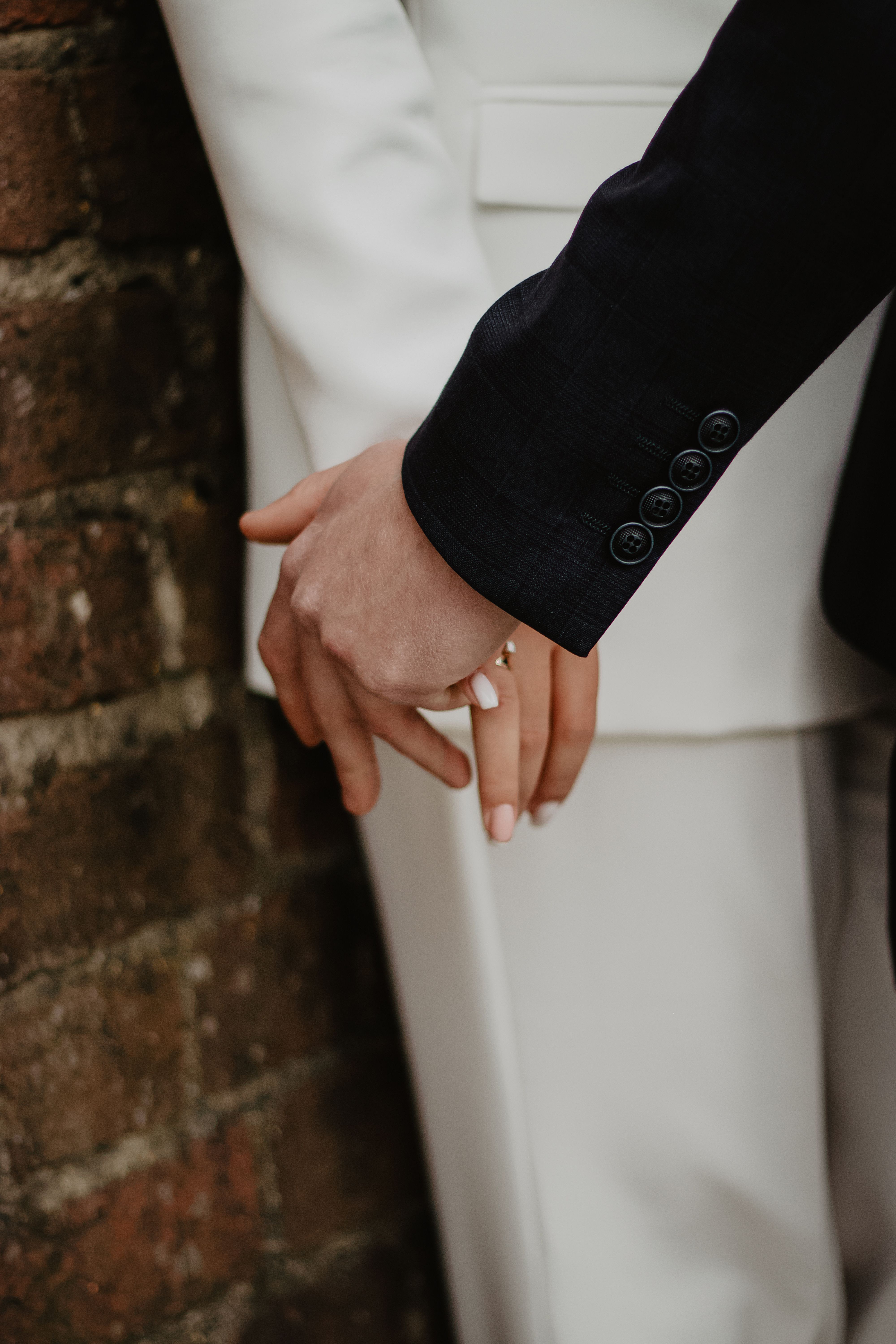 Low Angle Shot of People Wearing Coats Holding Each Others Hands · Free ...