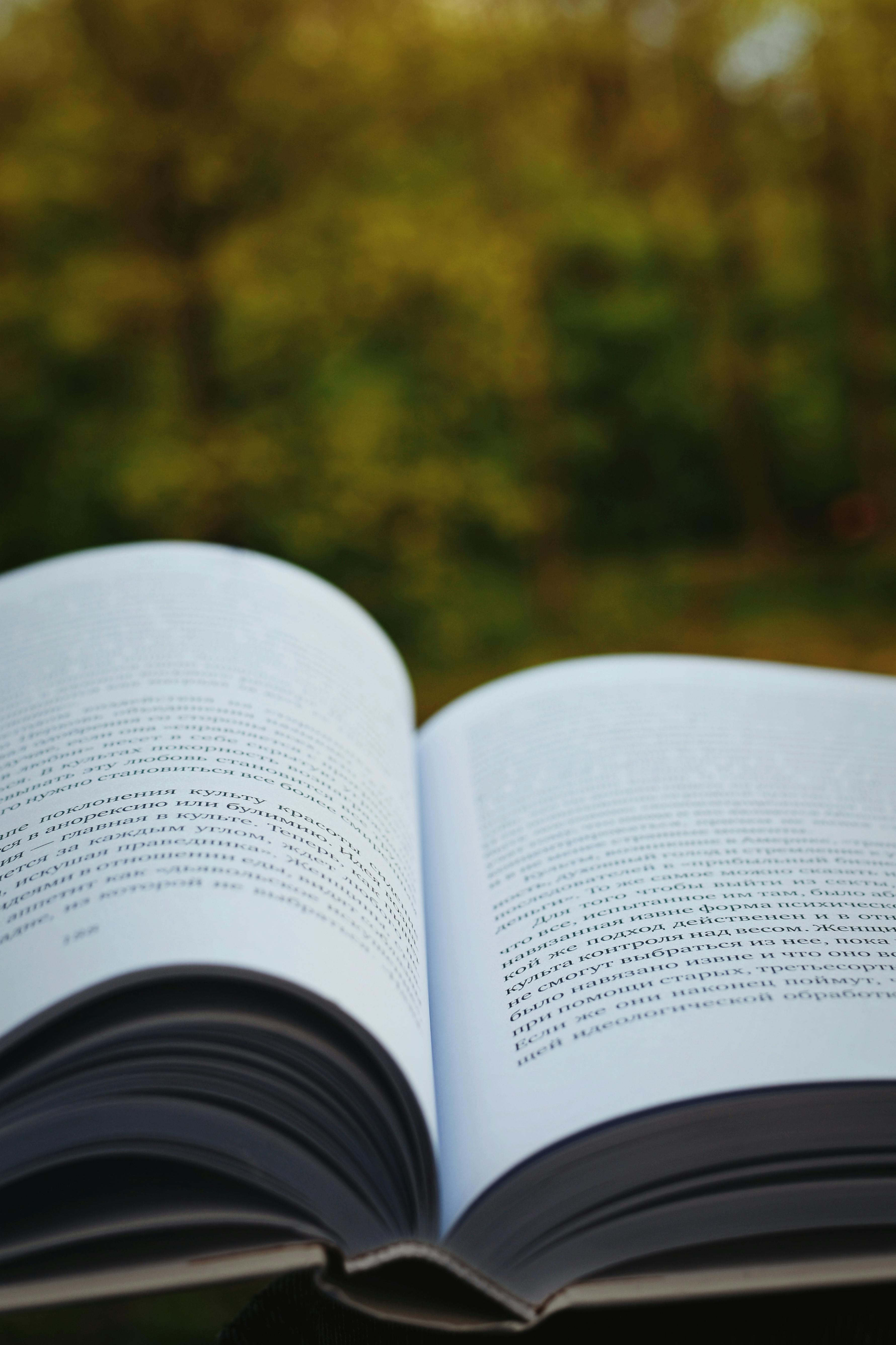 Open Book among Rotting Apples · Free Stock Photo