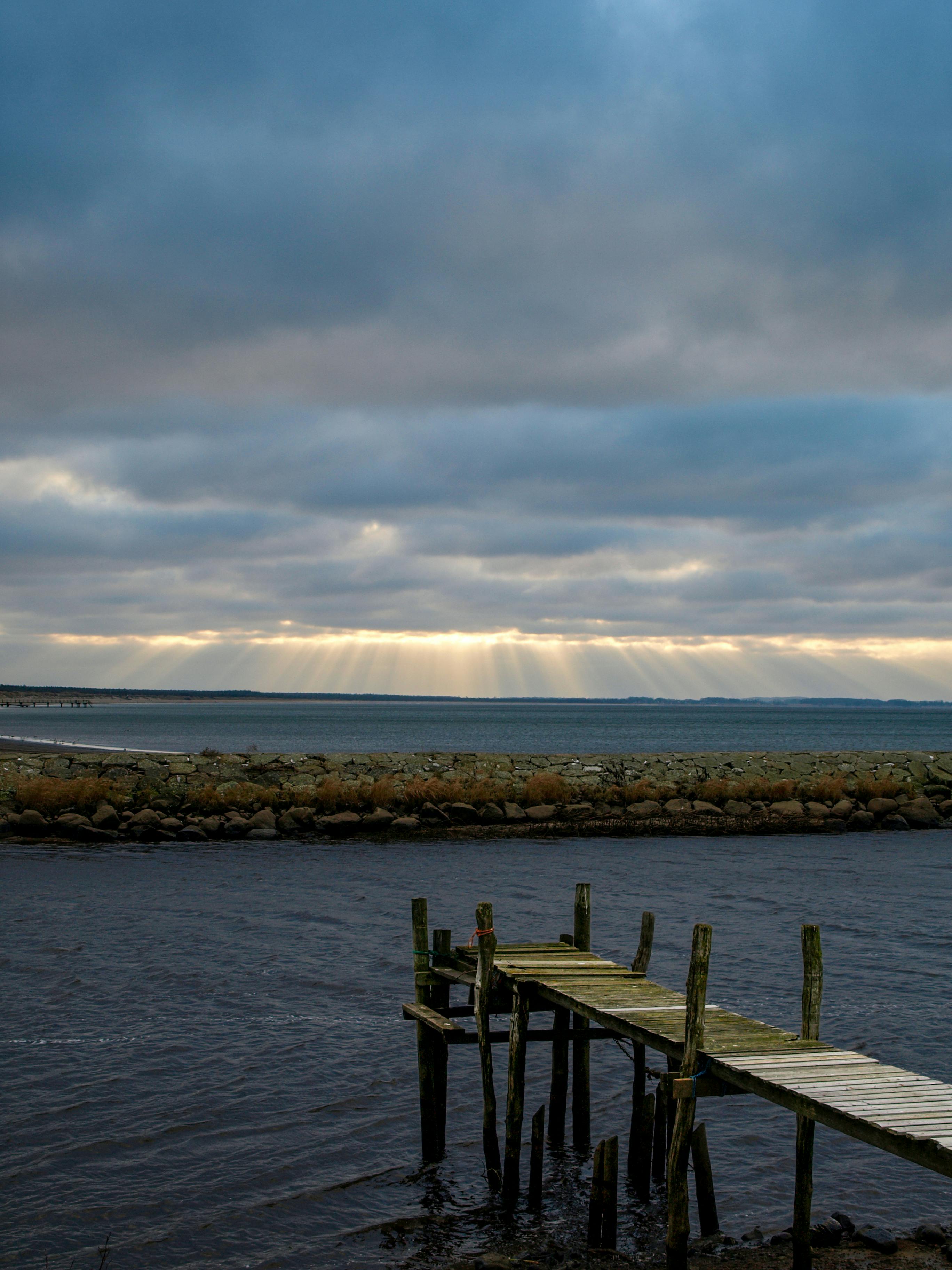 Overcast over Wooden Pier on Shore · Free Stock Photo