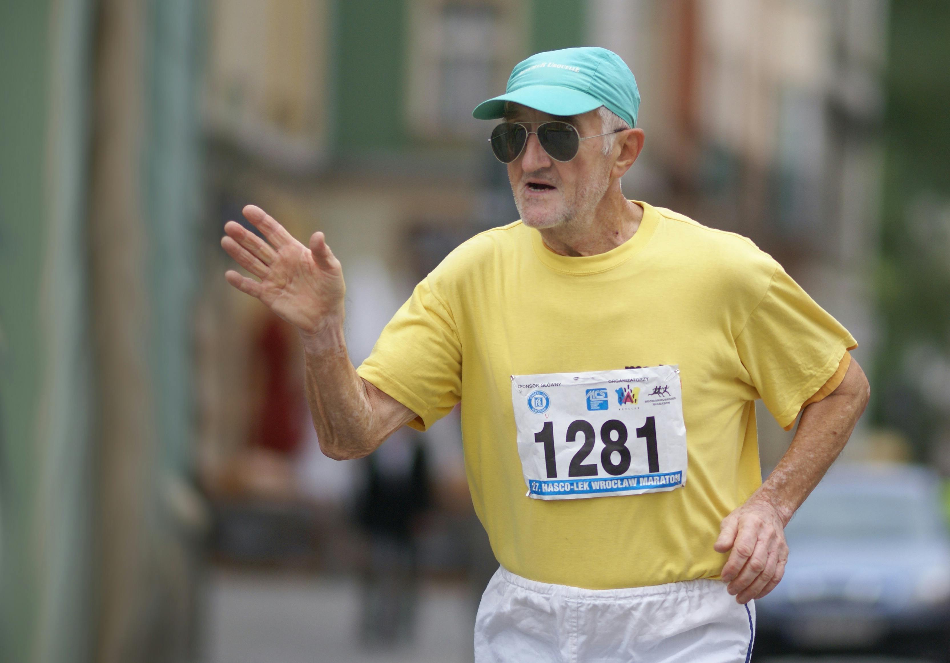 An older man running in a race · Free Stock Photo