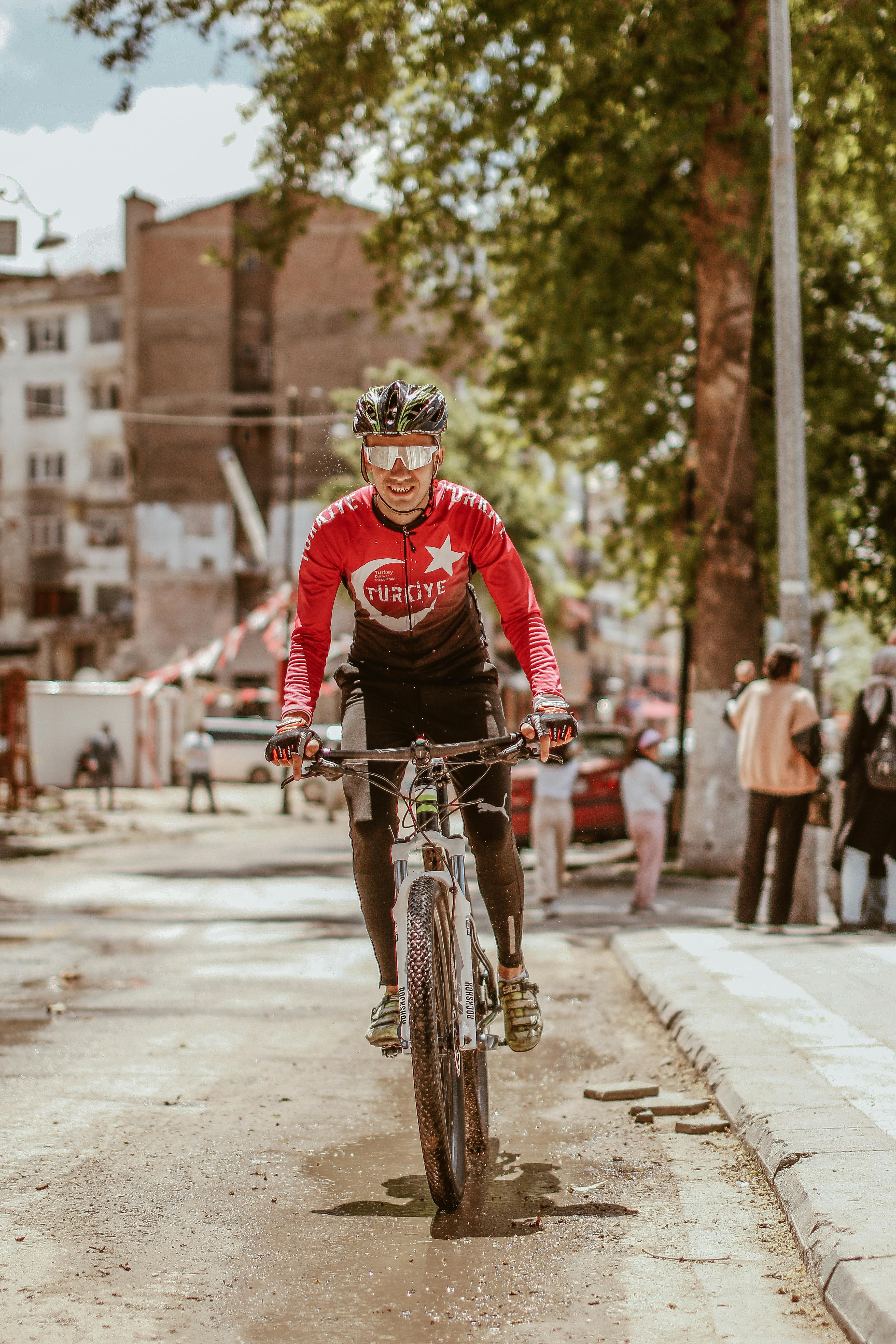 A Male Cyclist Riding a Bike · Free Stock Photo