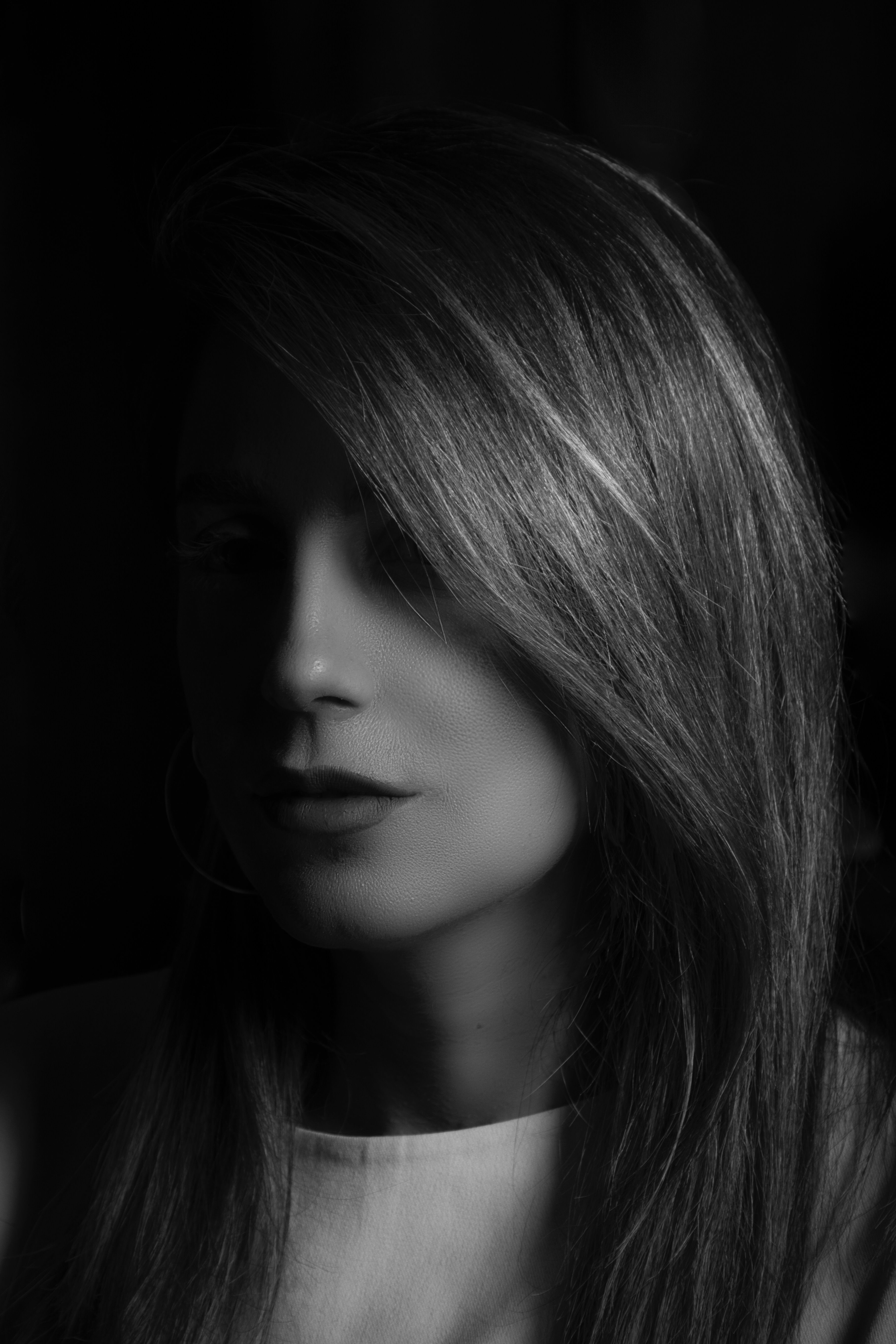 Young Woman Standing with Hands Behind Back · Free Stock Photo