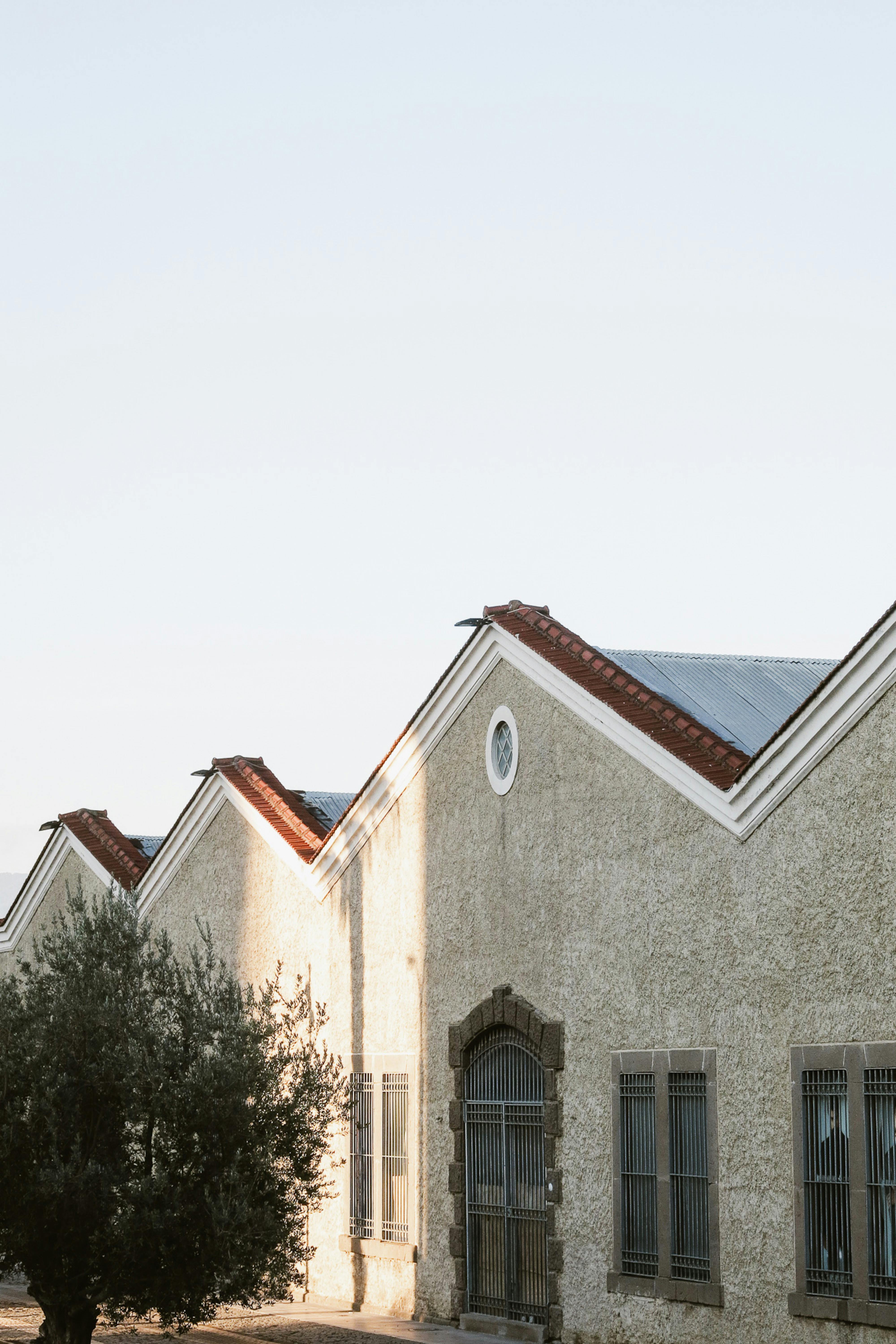 Exterior of a Gray Building with Bars on Windows and the Door · Free ...