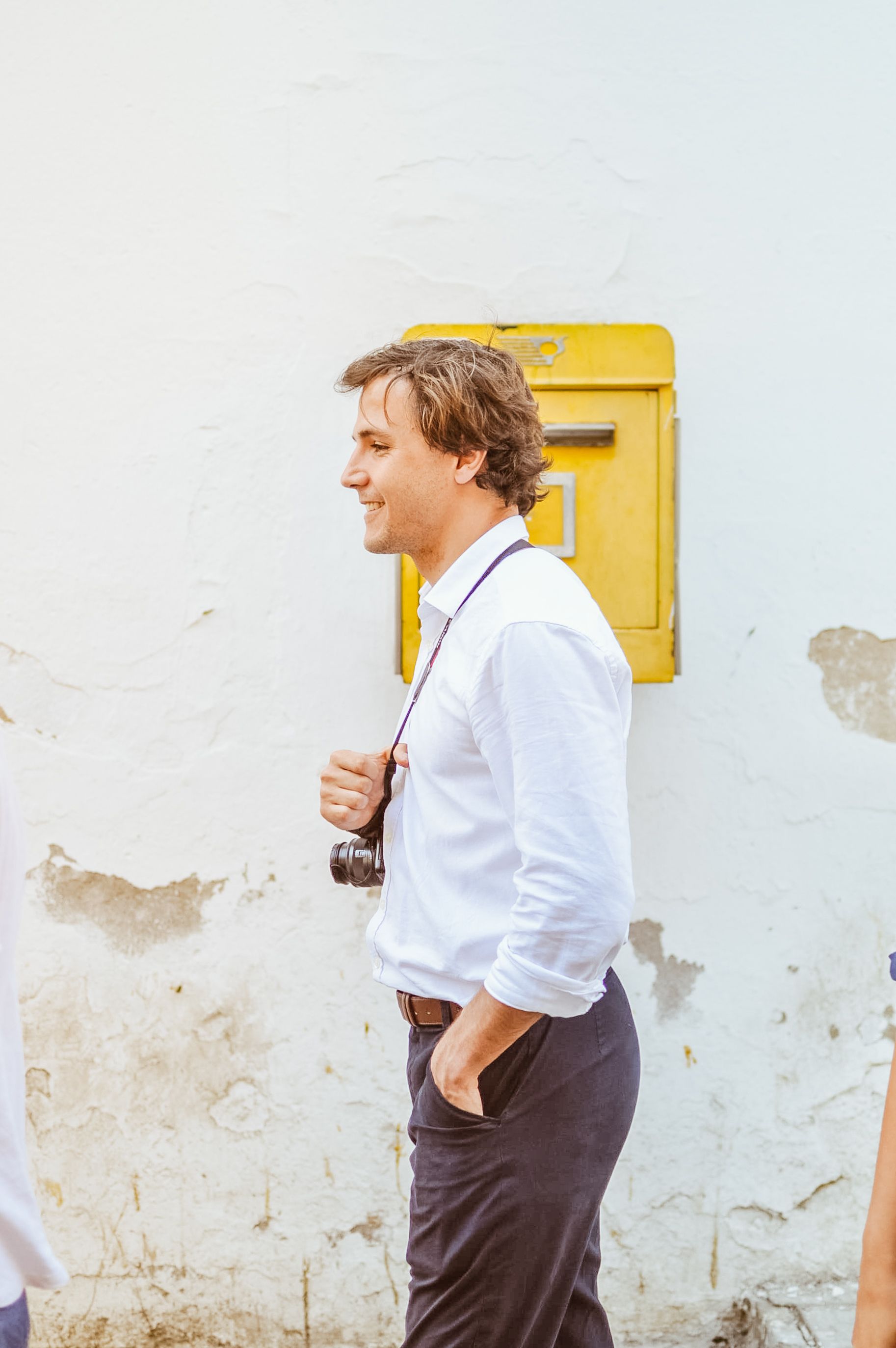 Smiling Man with Camera · Free Stock Photo
