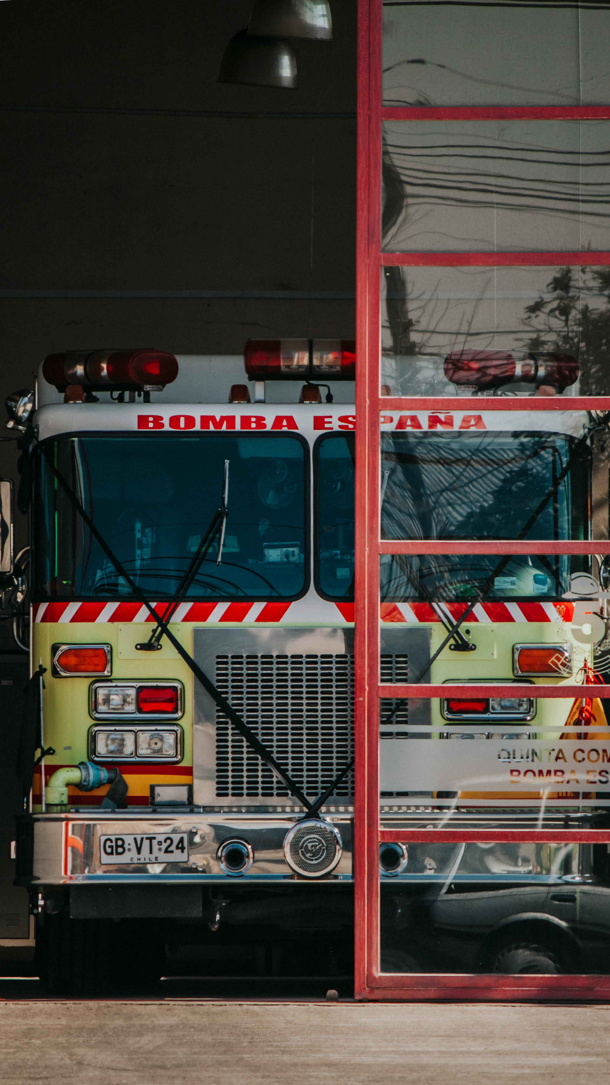 Spanish Firetruck behind Windows · Free Stock Photo