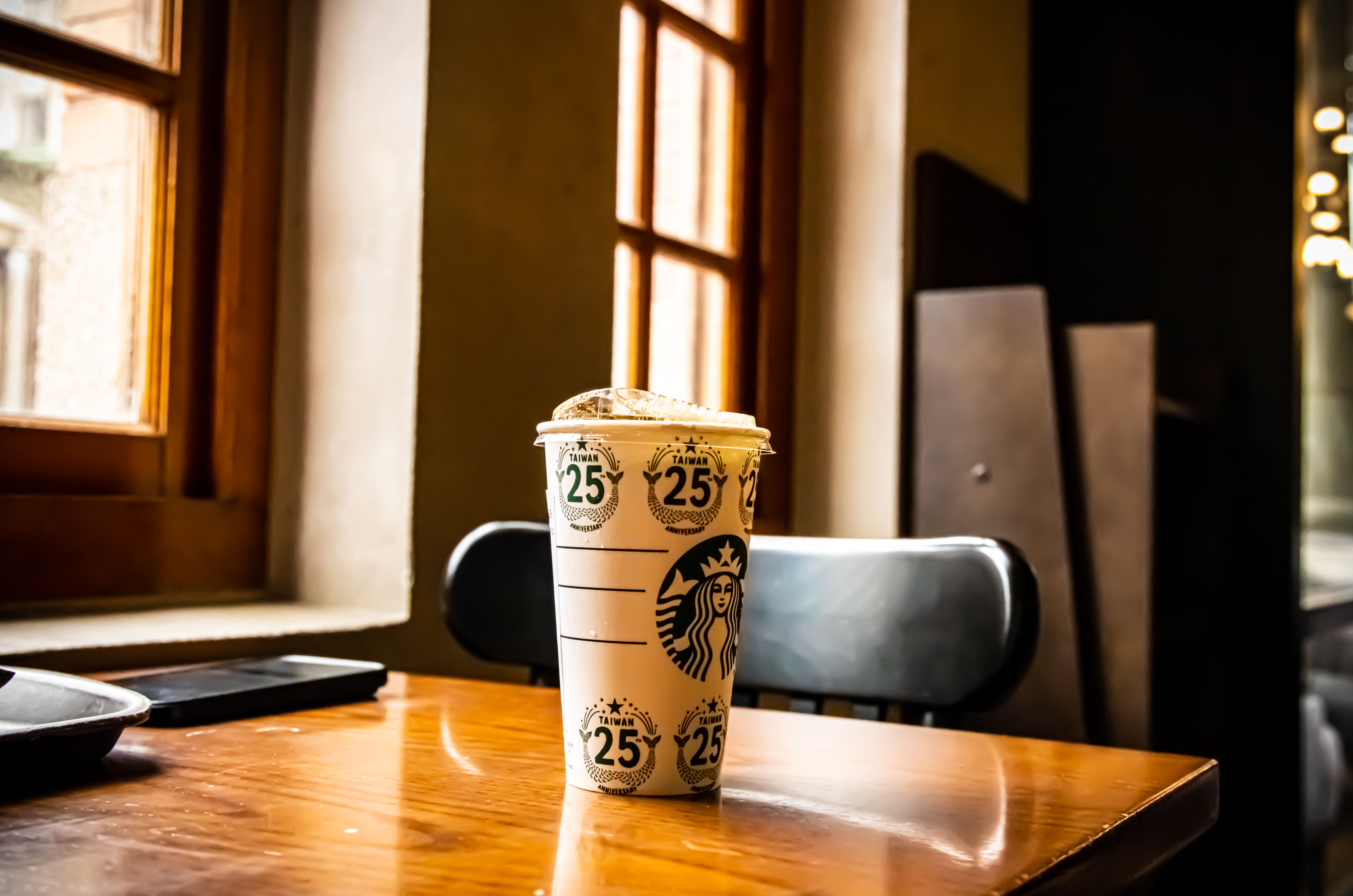 Starbucks Cup on Table · Free Stock Photo