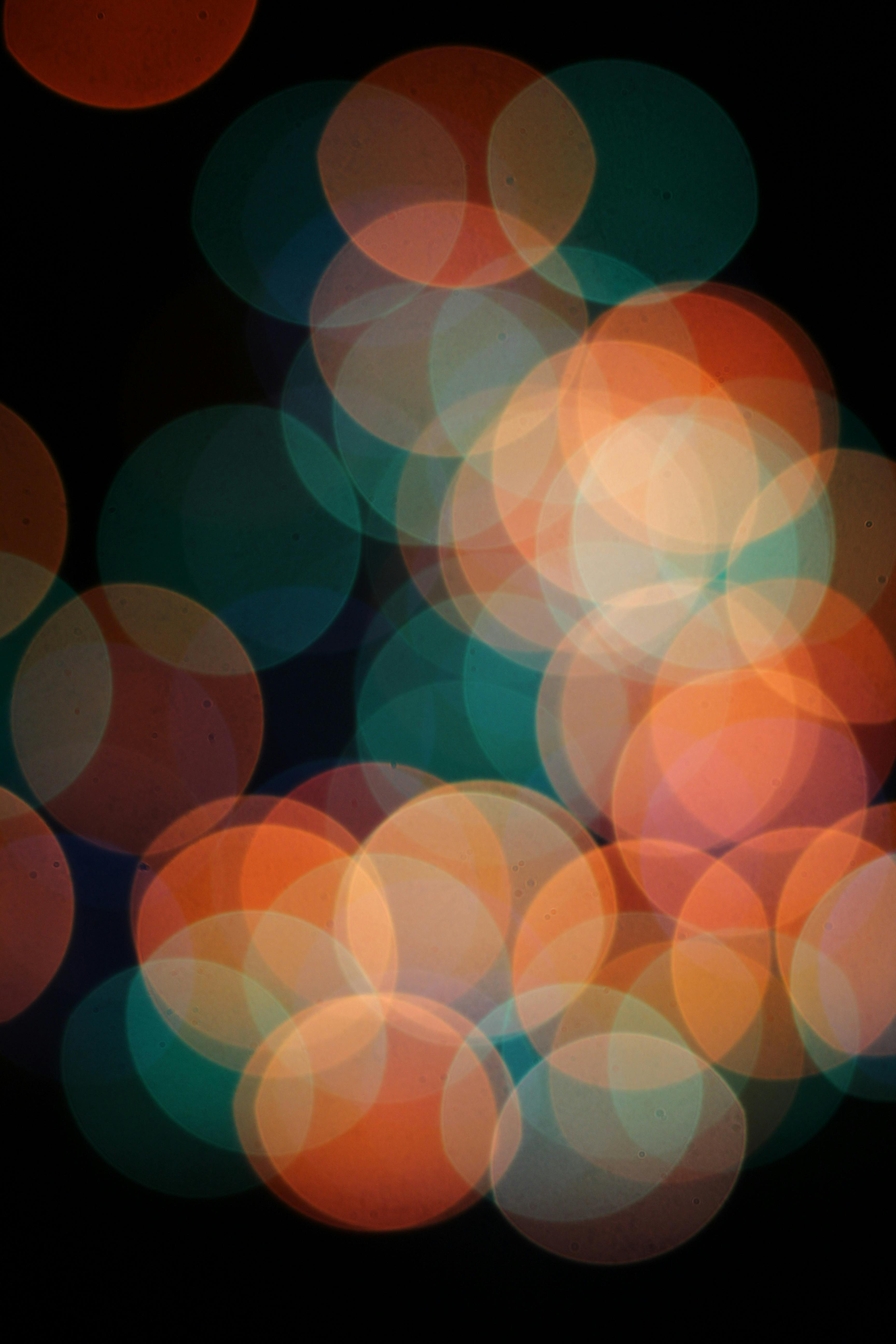 A black background with a colorful light pattern · Free Stock Photo