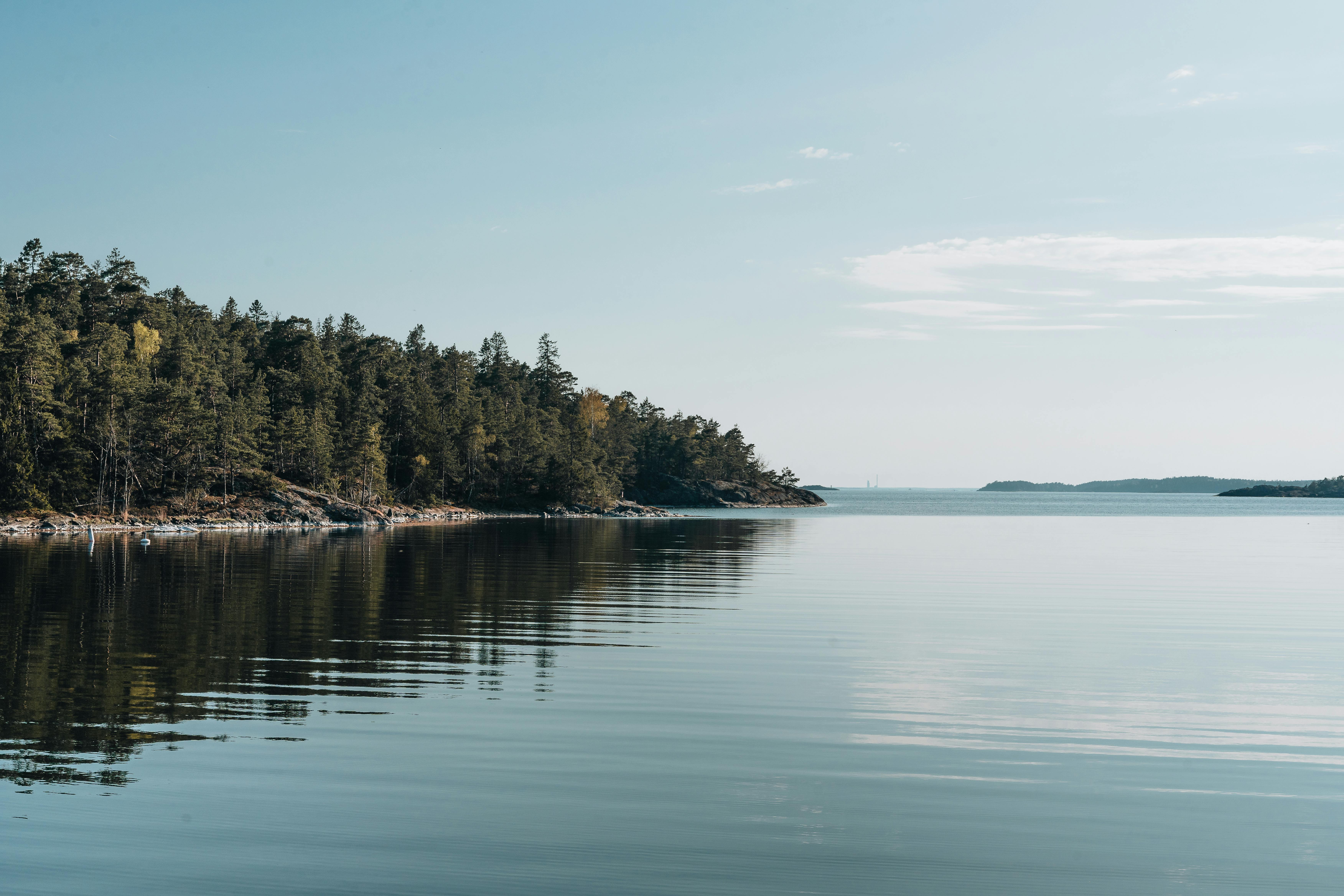 Sun Setting in Calm Still Water · Free Stock Photo