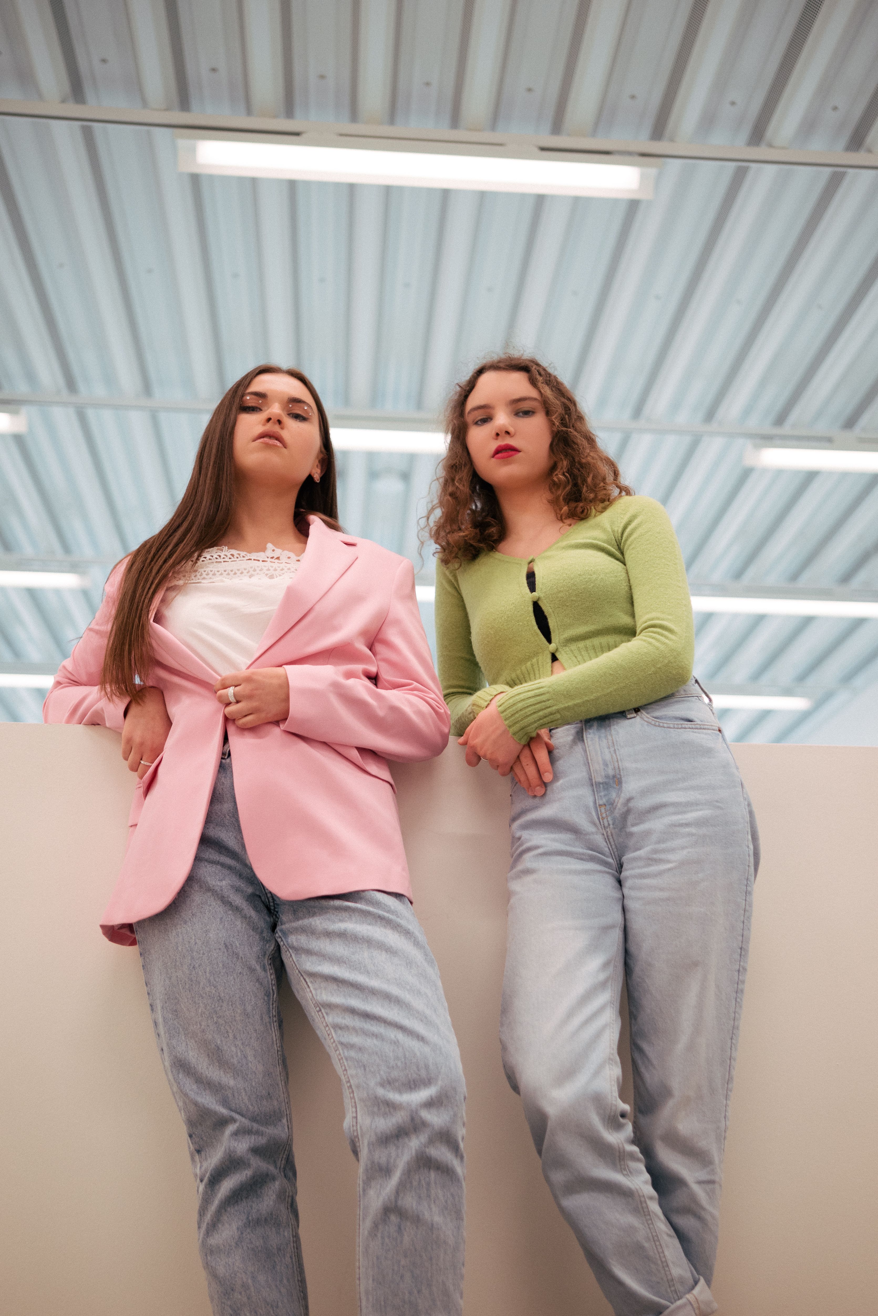 Women Posing by Wall · Free Stock Photo