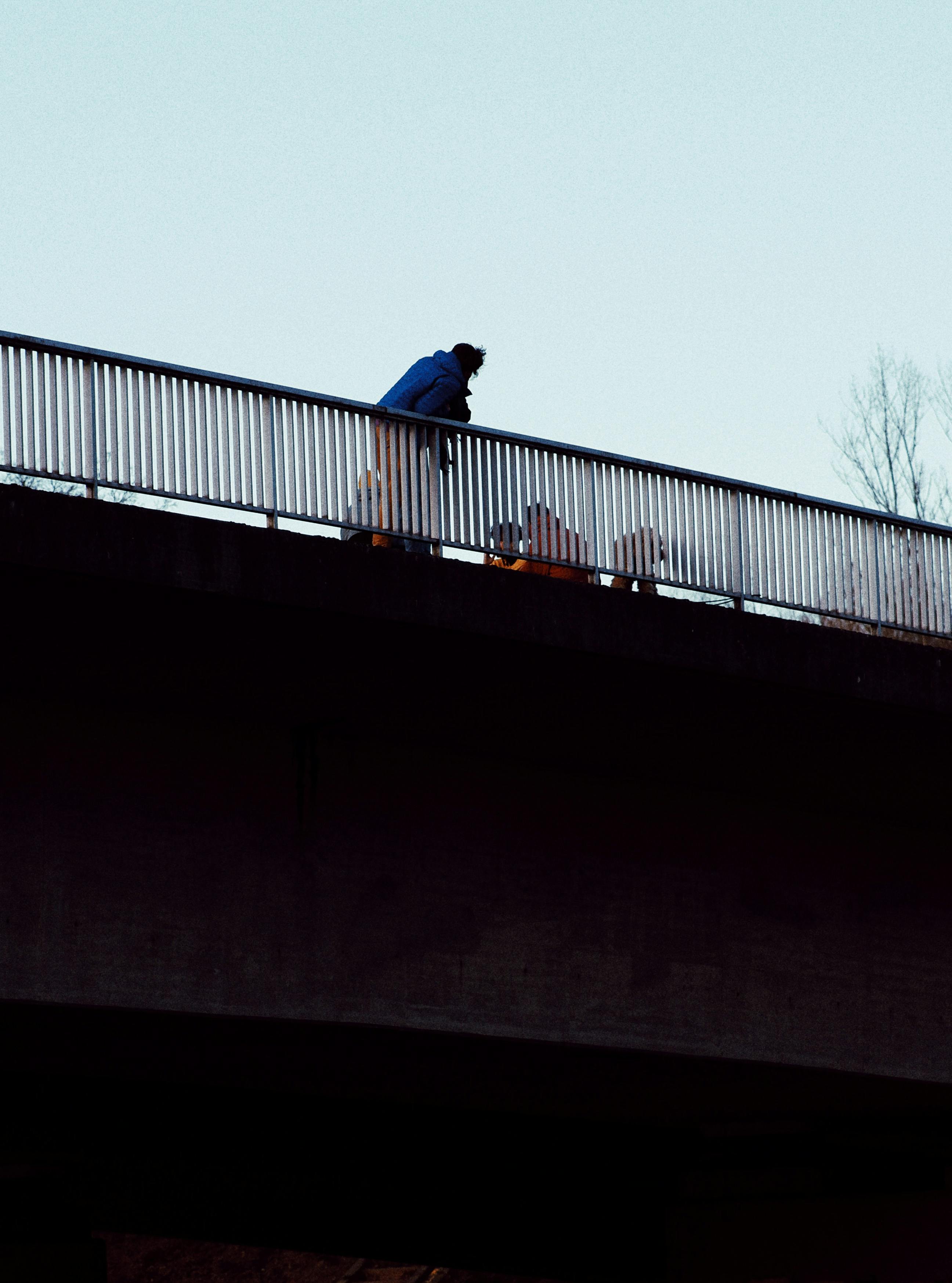 Person Standing on Bridge · Free Stock Photo