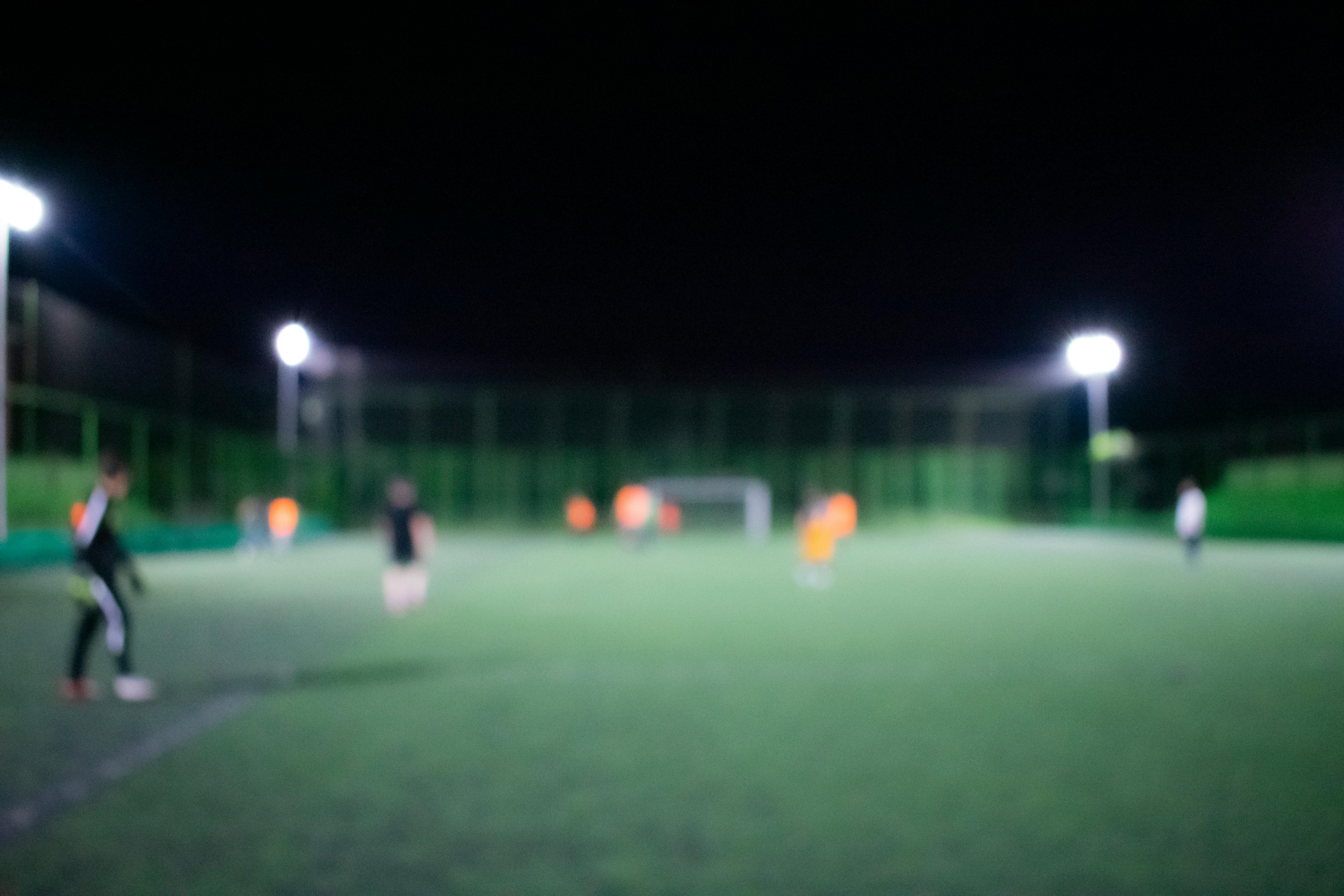 Men on Football Pitch at Night · Free Stock Photo