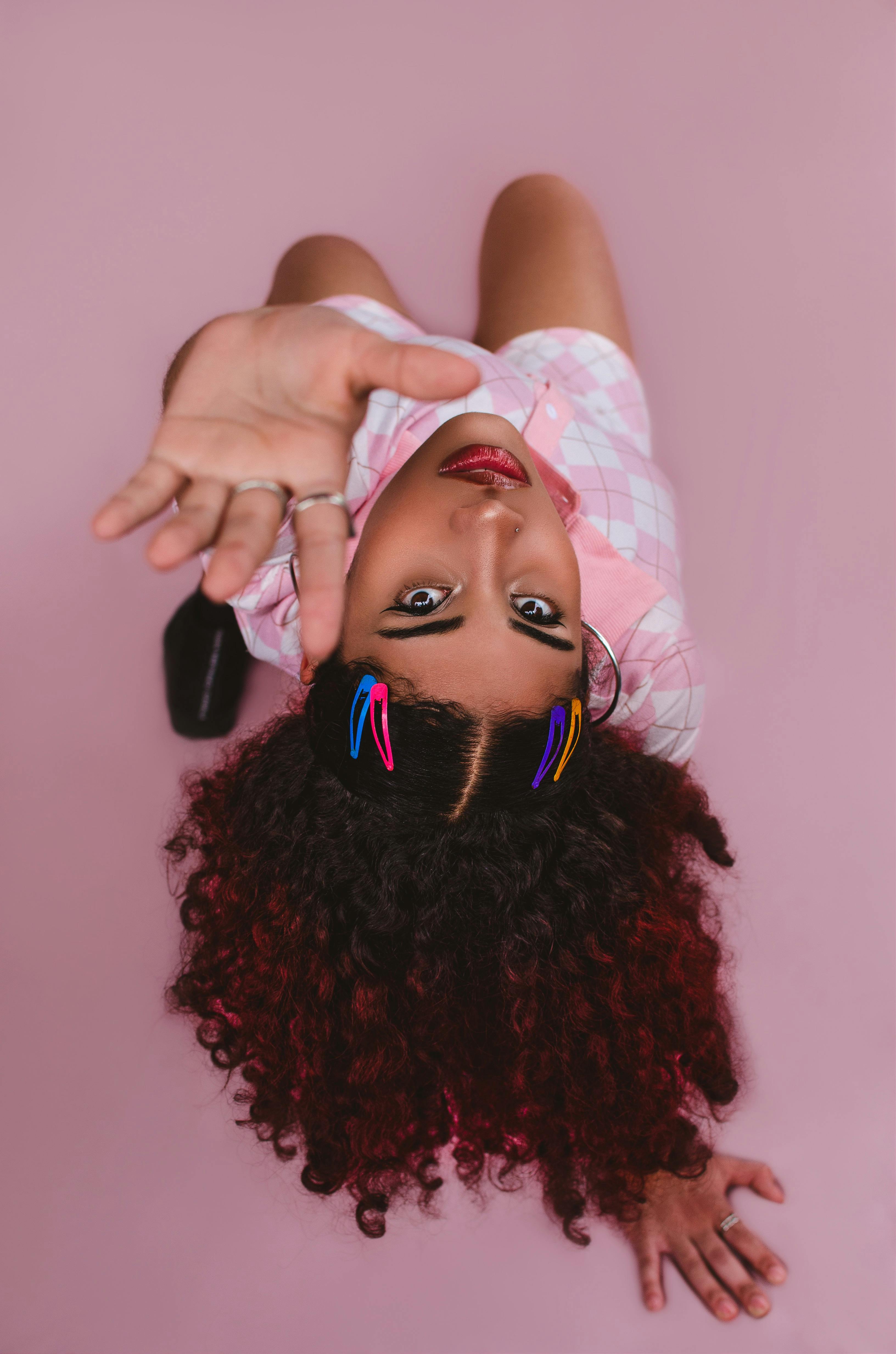 Top View of a Woman Kneeling and Looking up · Free Stock Photo