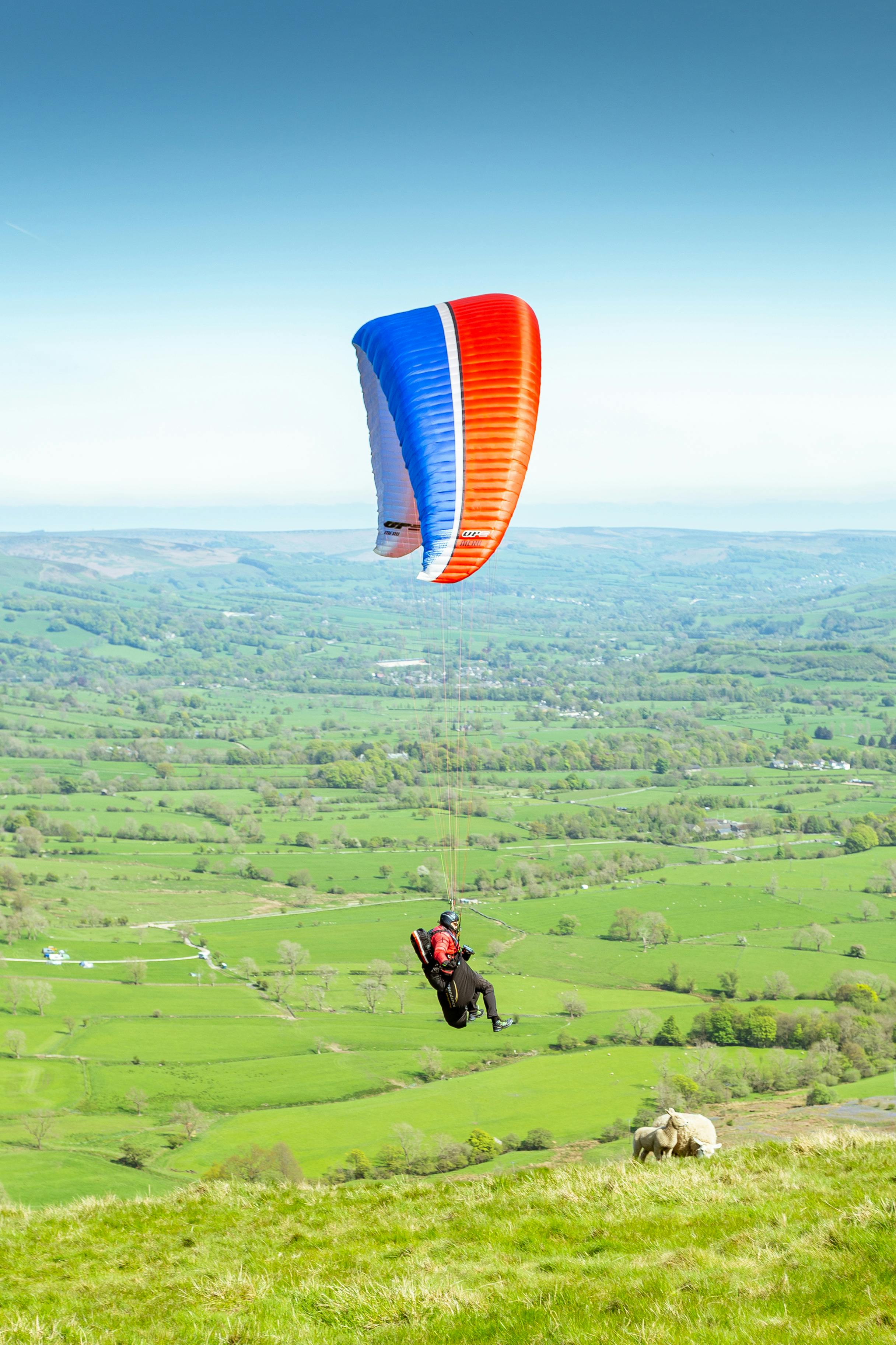 Person Flying over Fields · Free Stock Photo