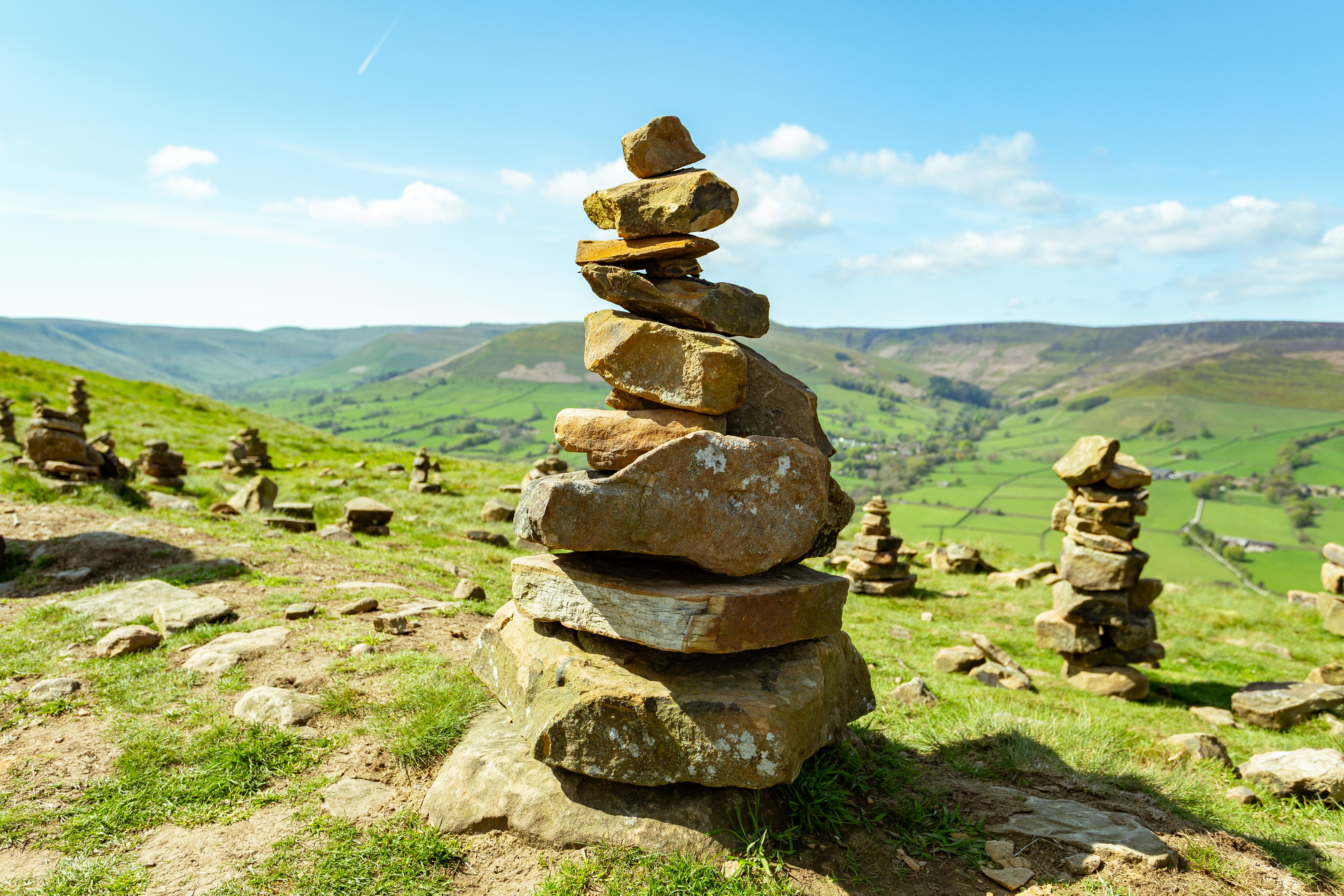 Stones Stacked on Grassland · Free Stock Photo