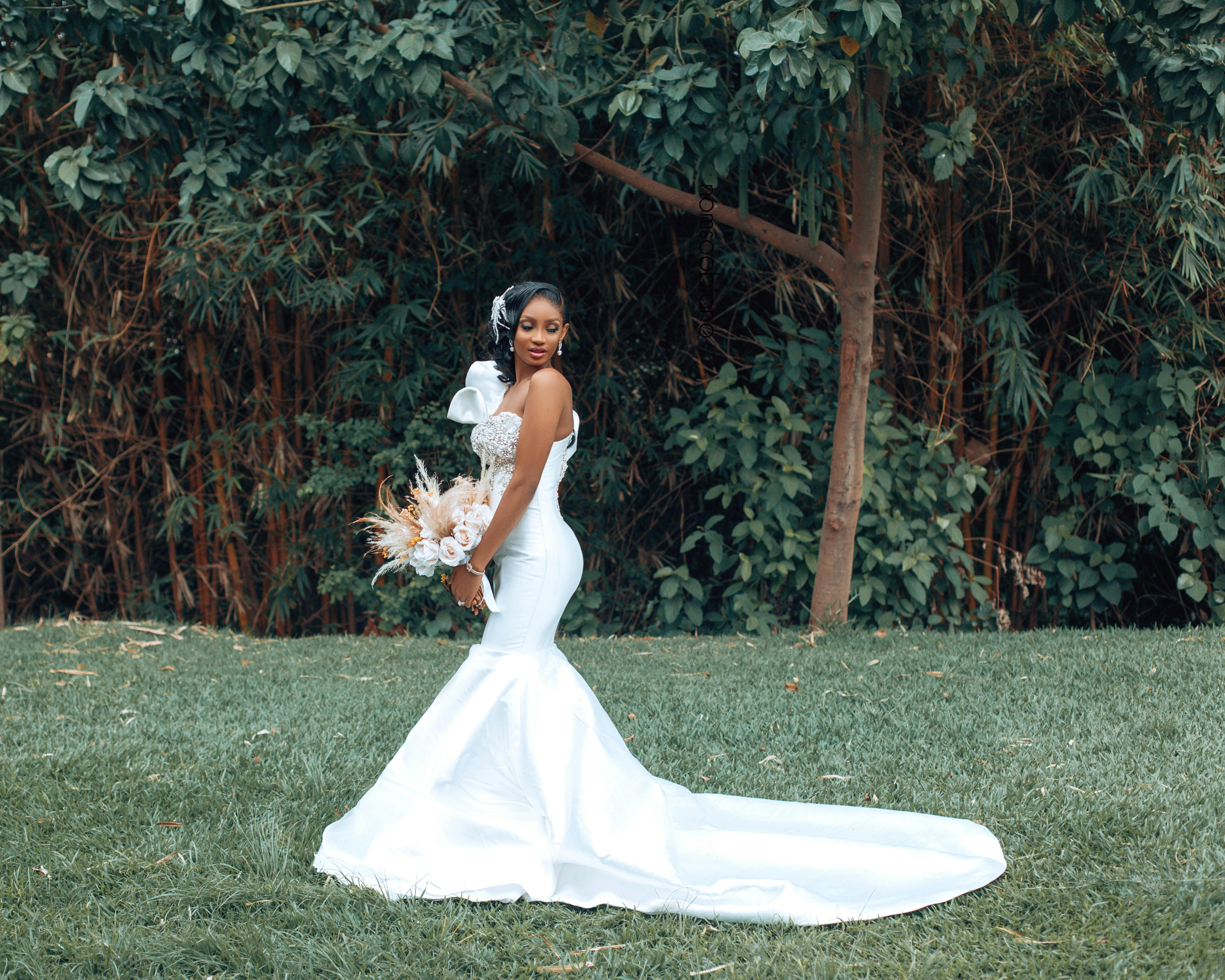 Bride Posing near Trees · Free Stock Photo
