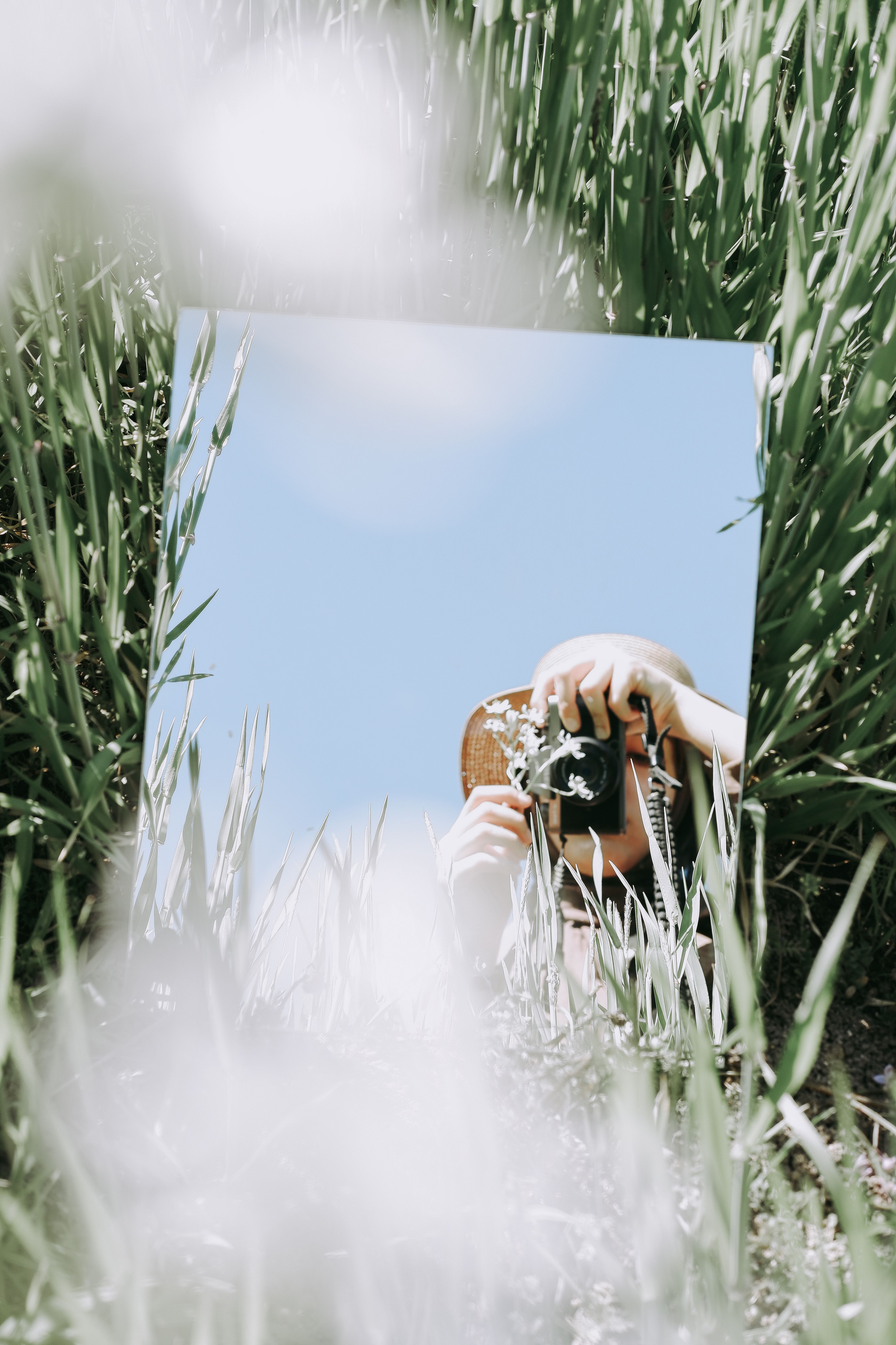 Mirror Reflection of a Woman Taking Photo with a Camera · Free Stock Photo