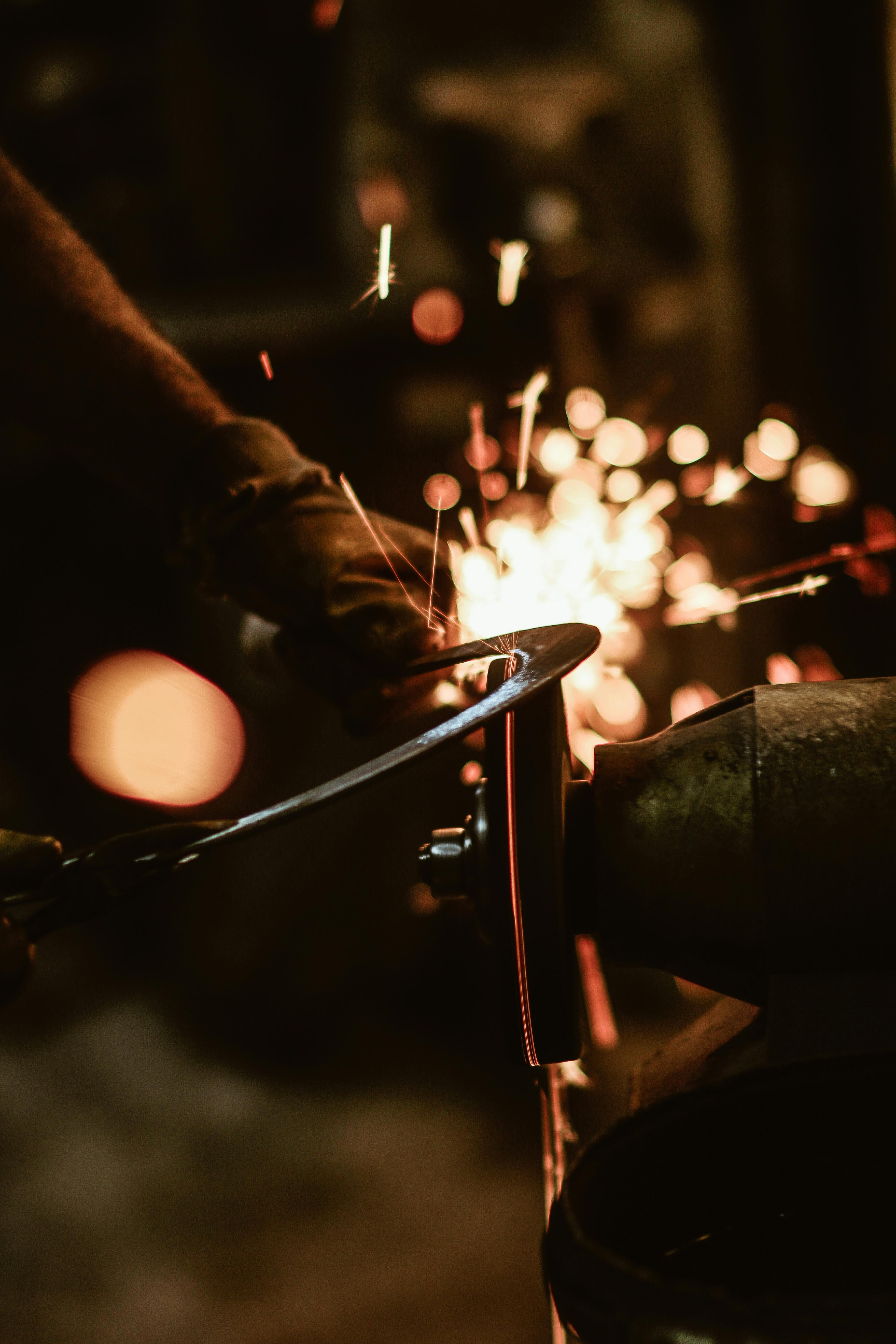 Man Using Bench Grinder · Free Stock Photo