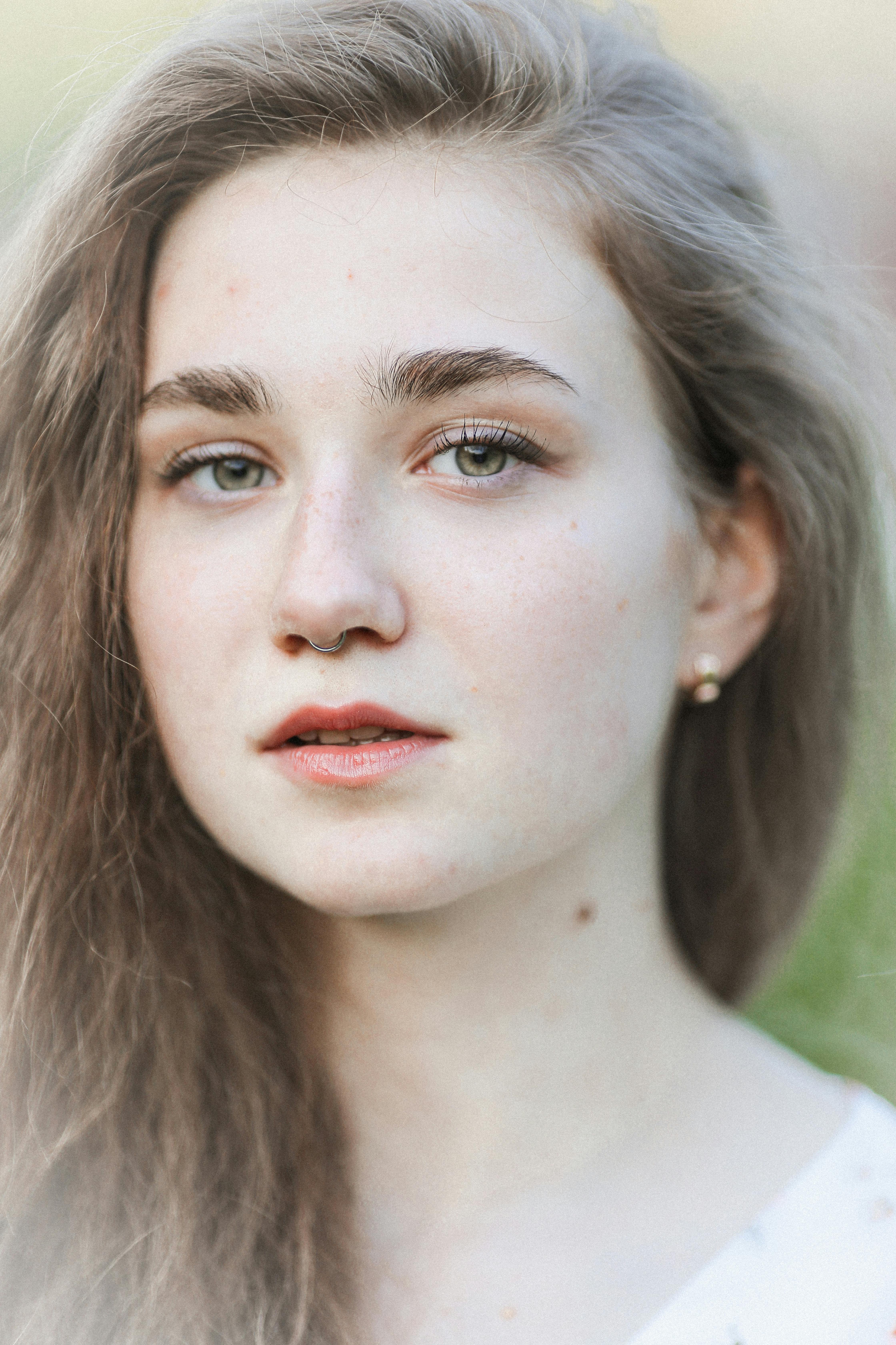 Portrait of a Young Woman with Dark Blonde Hair · Free Stock Photo