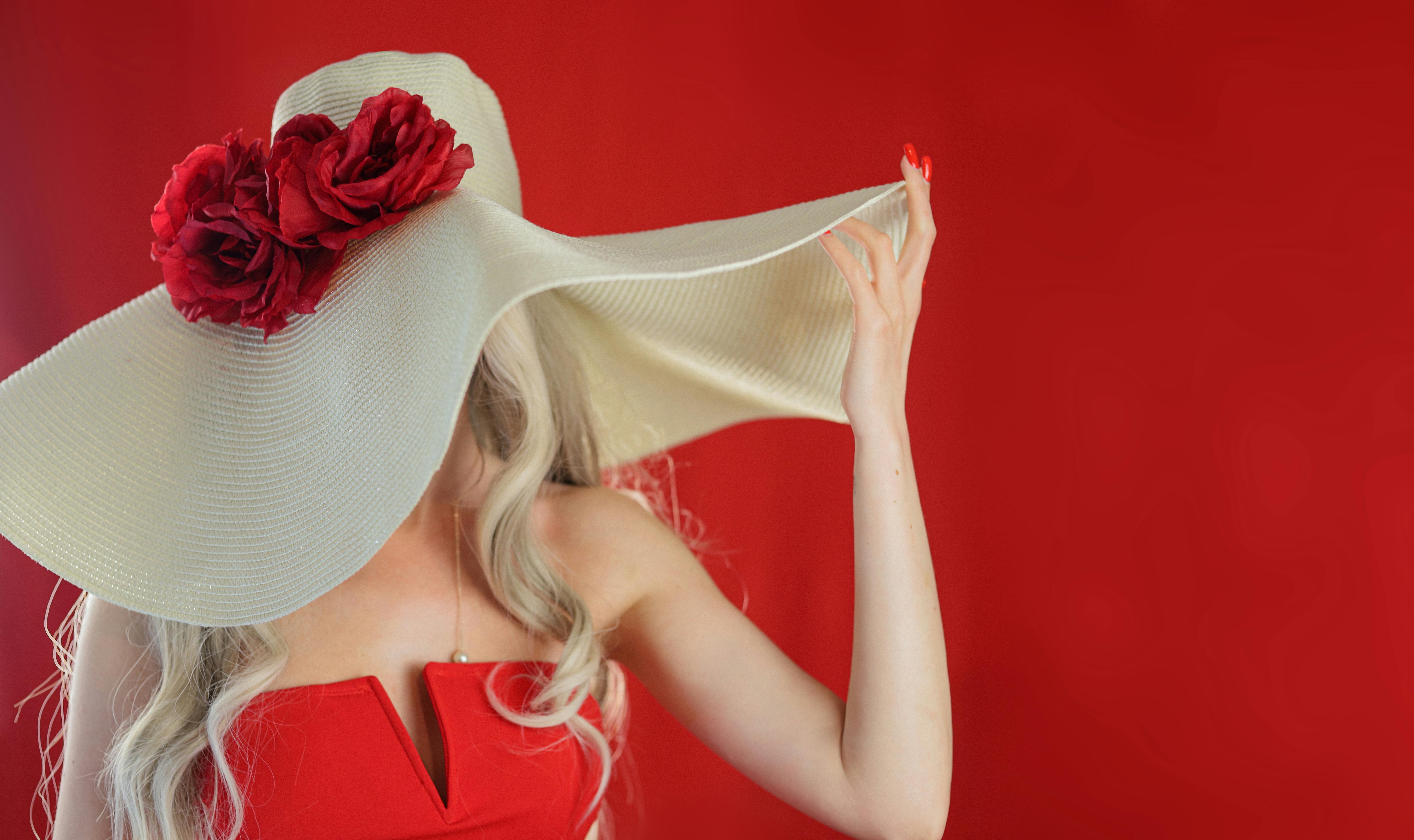Young Woman Wearing a Large Hat Covering Her Face · Free Stock Photo