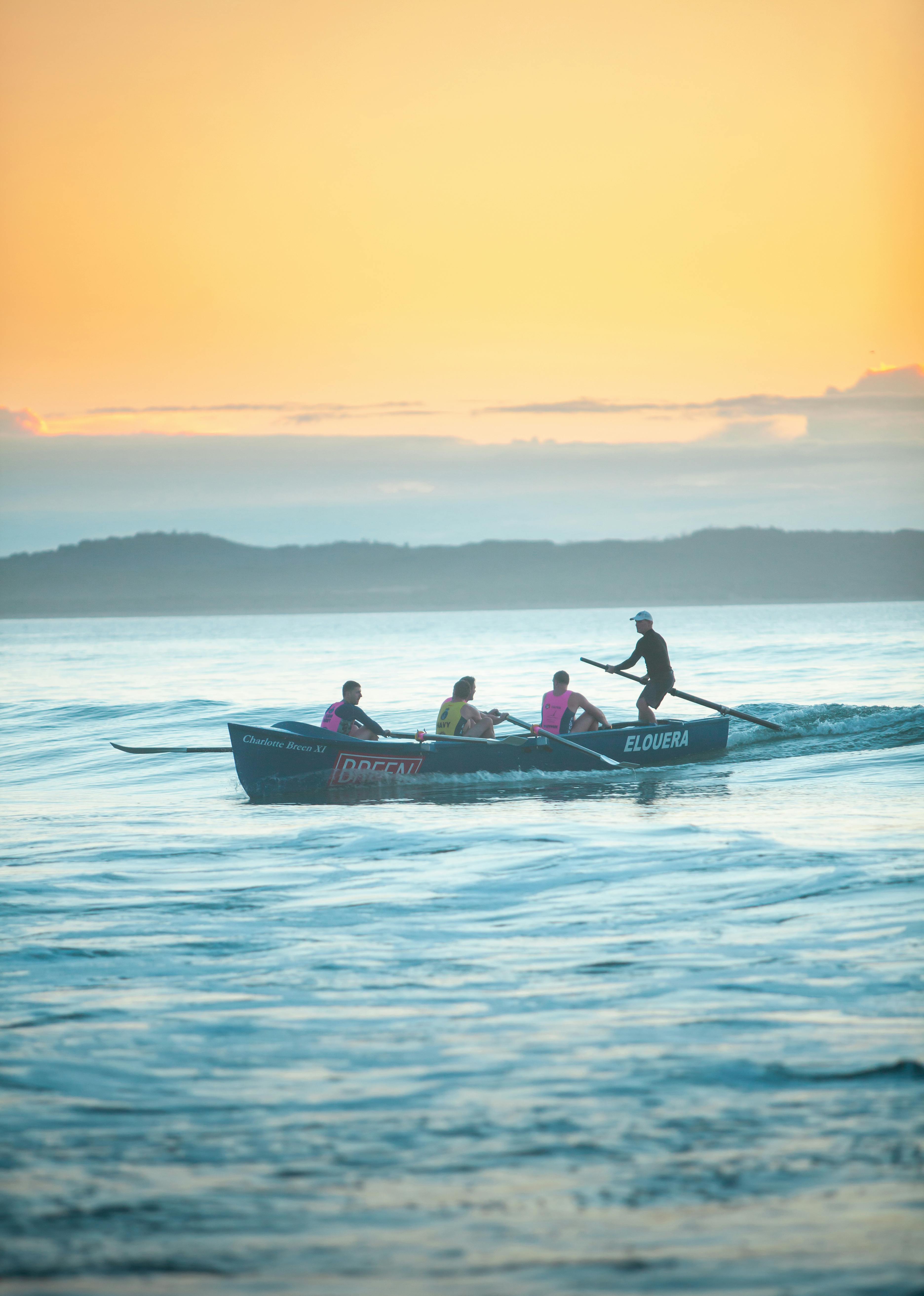 People Rowing on Boat at Sunset · Free Stock Photo