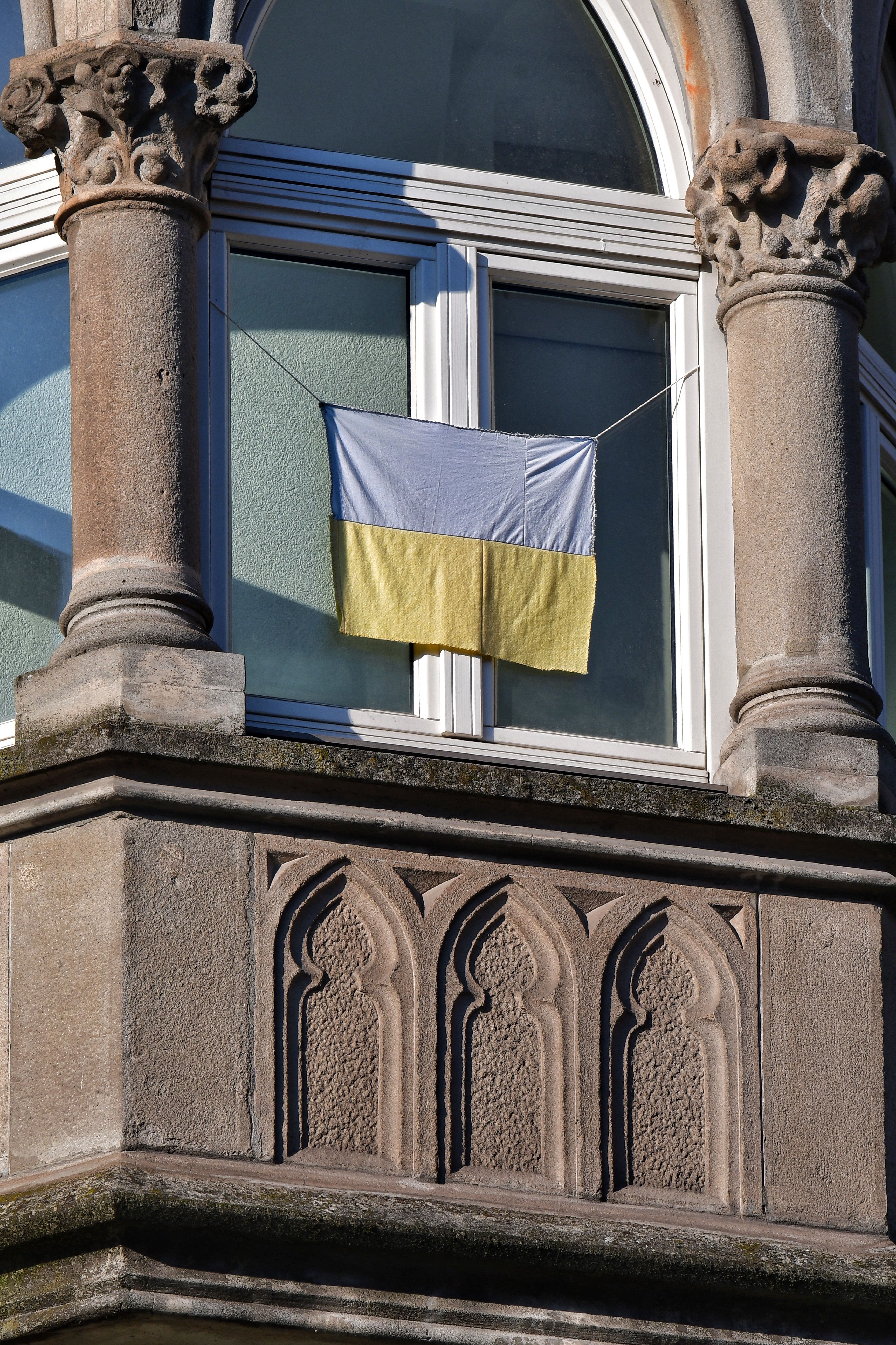 Flag of Ukraine Hanging in Window · Free Stock Photo