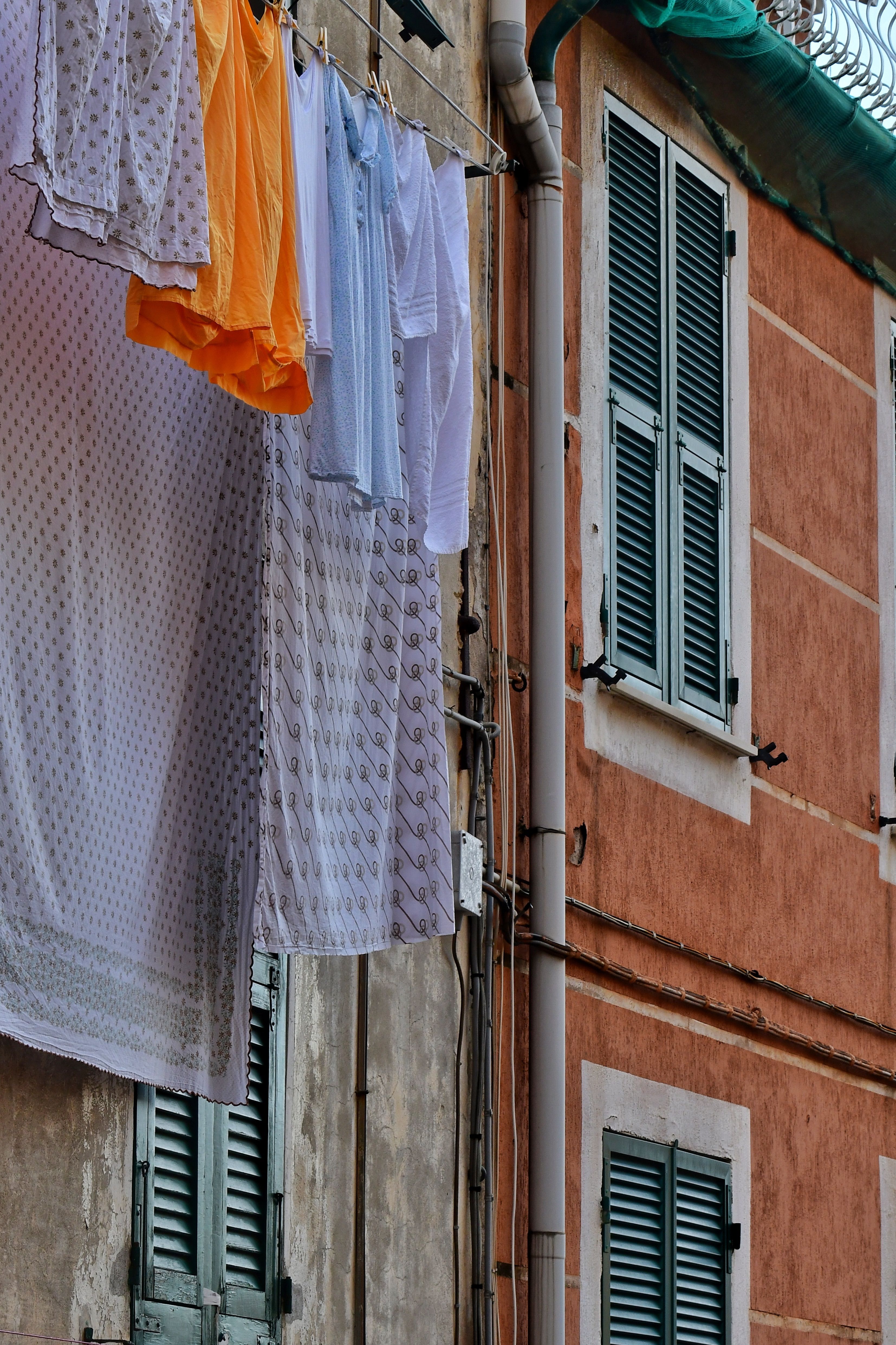 Clothes Hanging on Lines between Houses on a Narrow Street · Free Stock ...