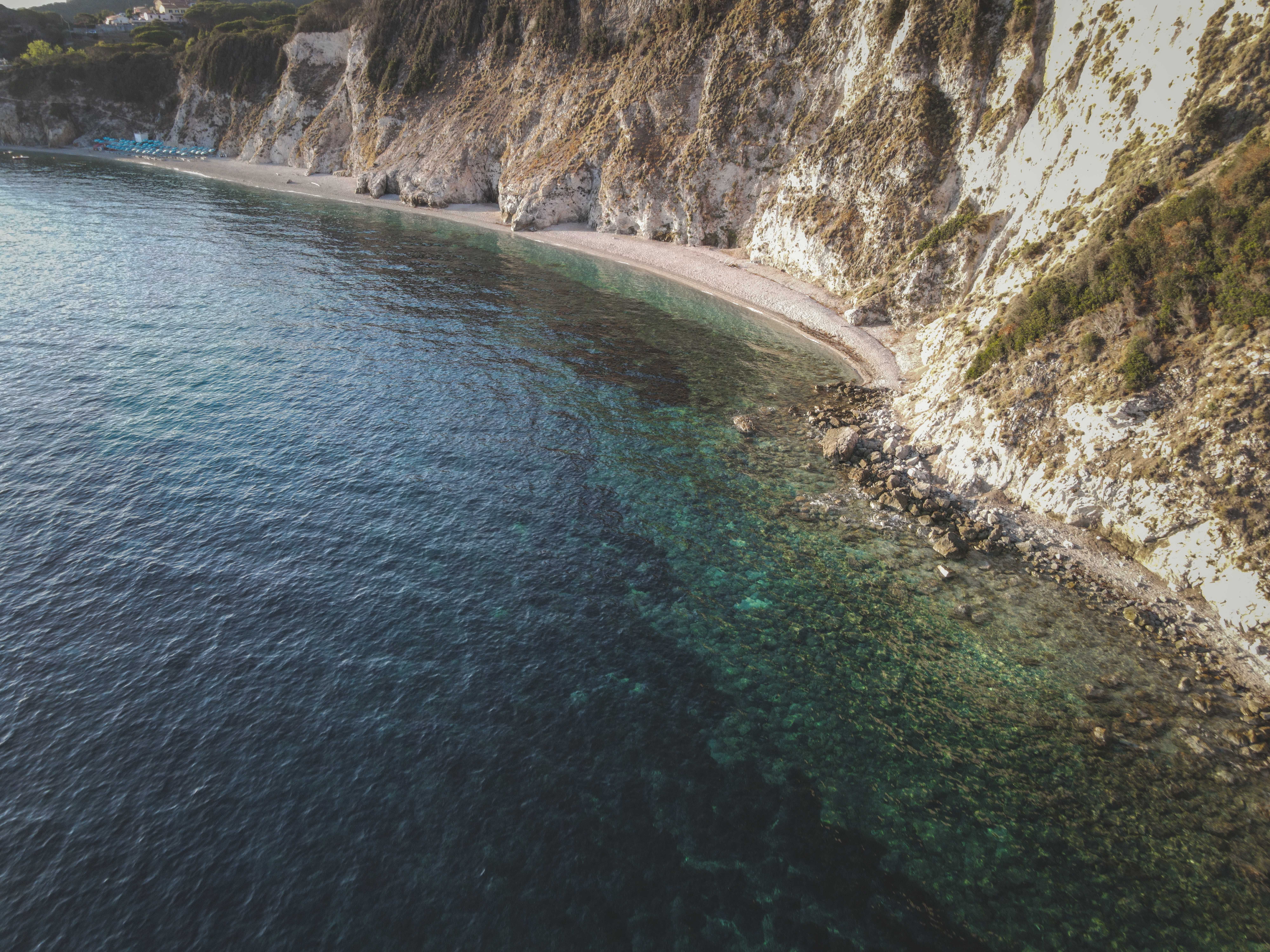 High Angle View of a Cliff and Sea · Free Stock Photo
