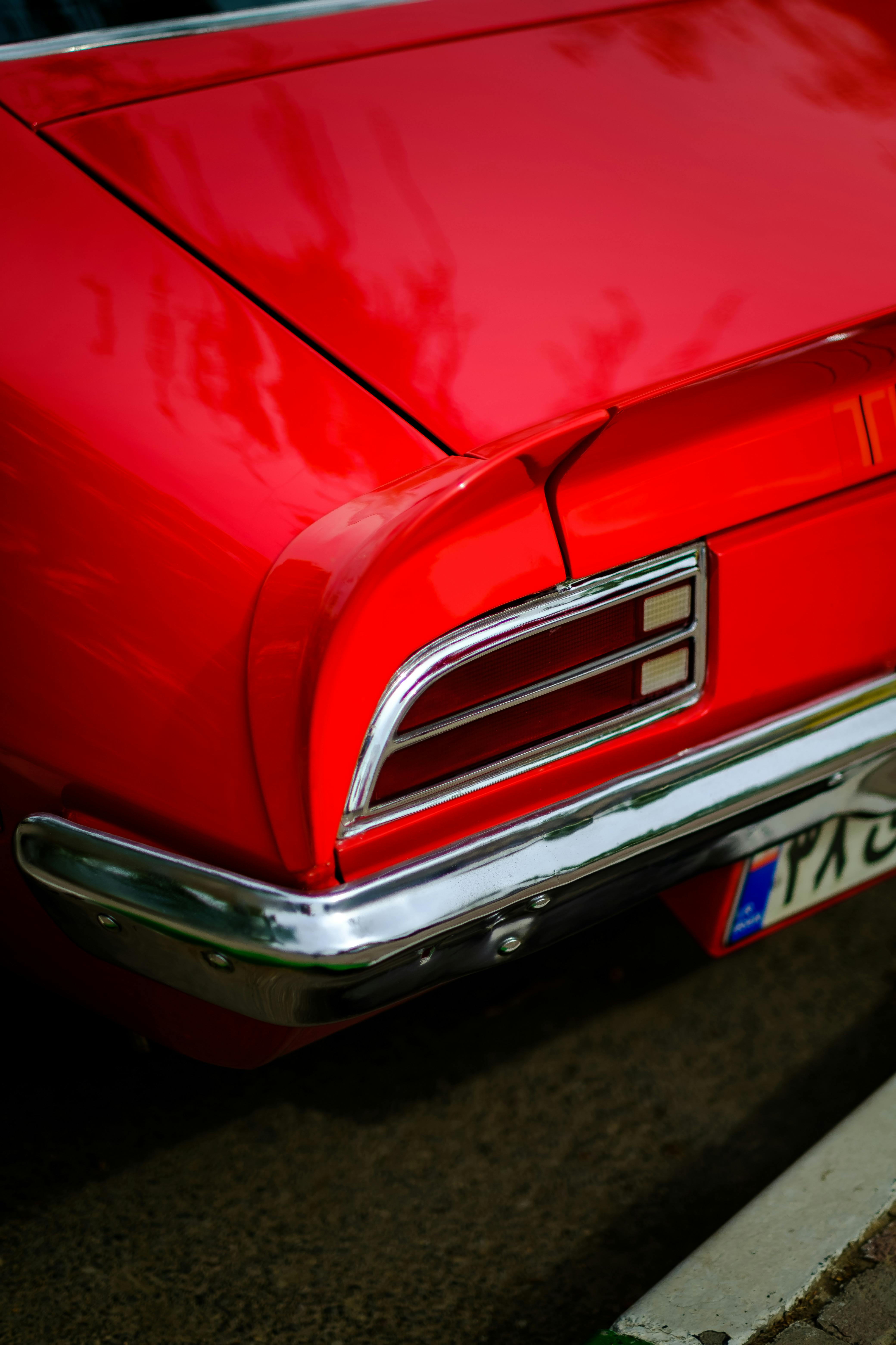 Rear View of a Vintage Red Pontiac Firebird Sports Car · Free Stock Photo