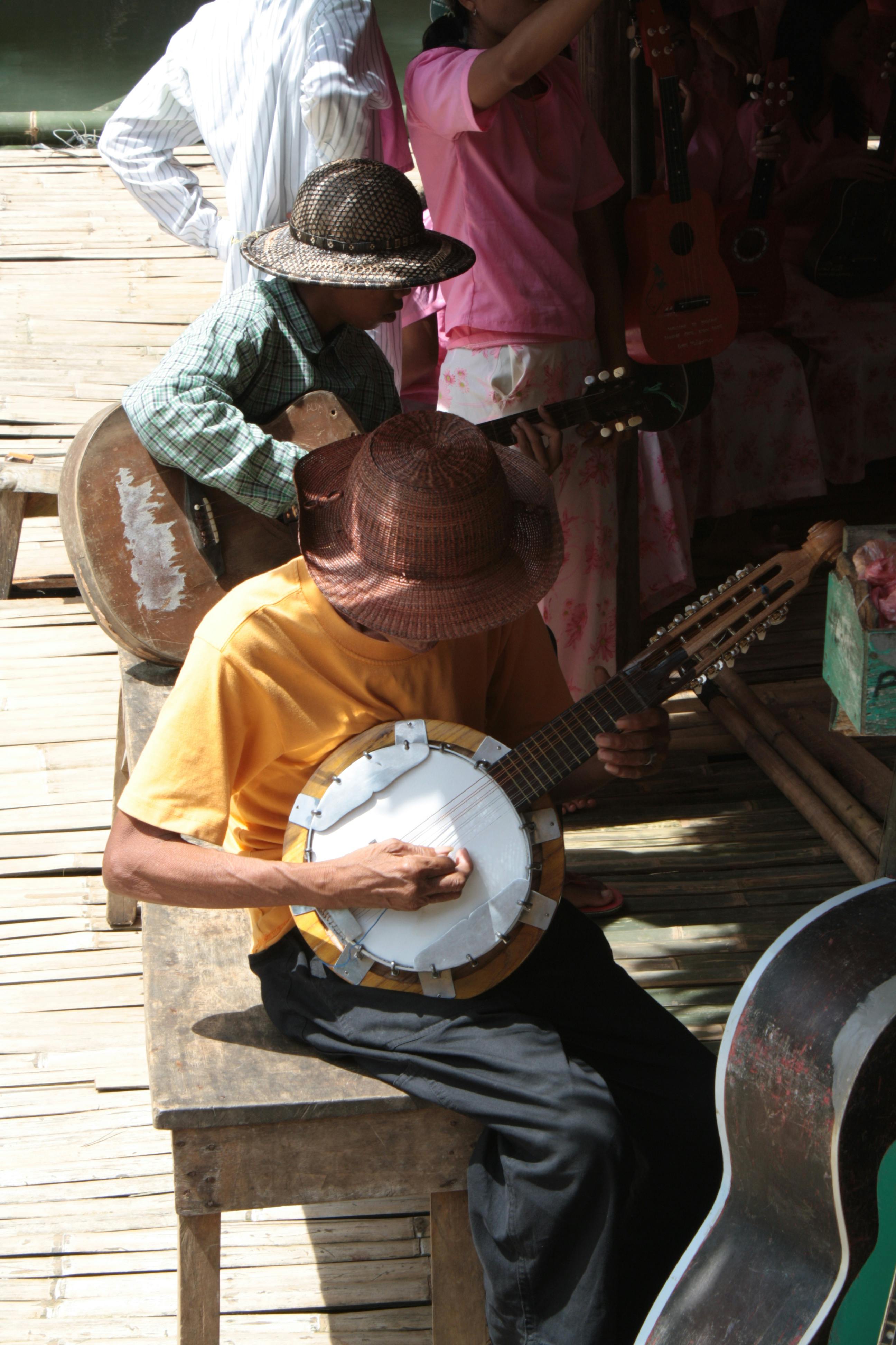 Men Sitting and Playing Traditional Musical Instruments · Free Stock Photo