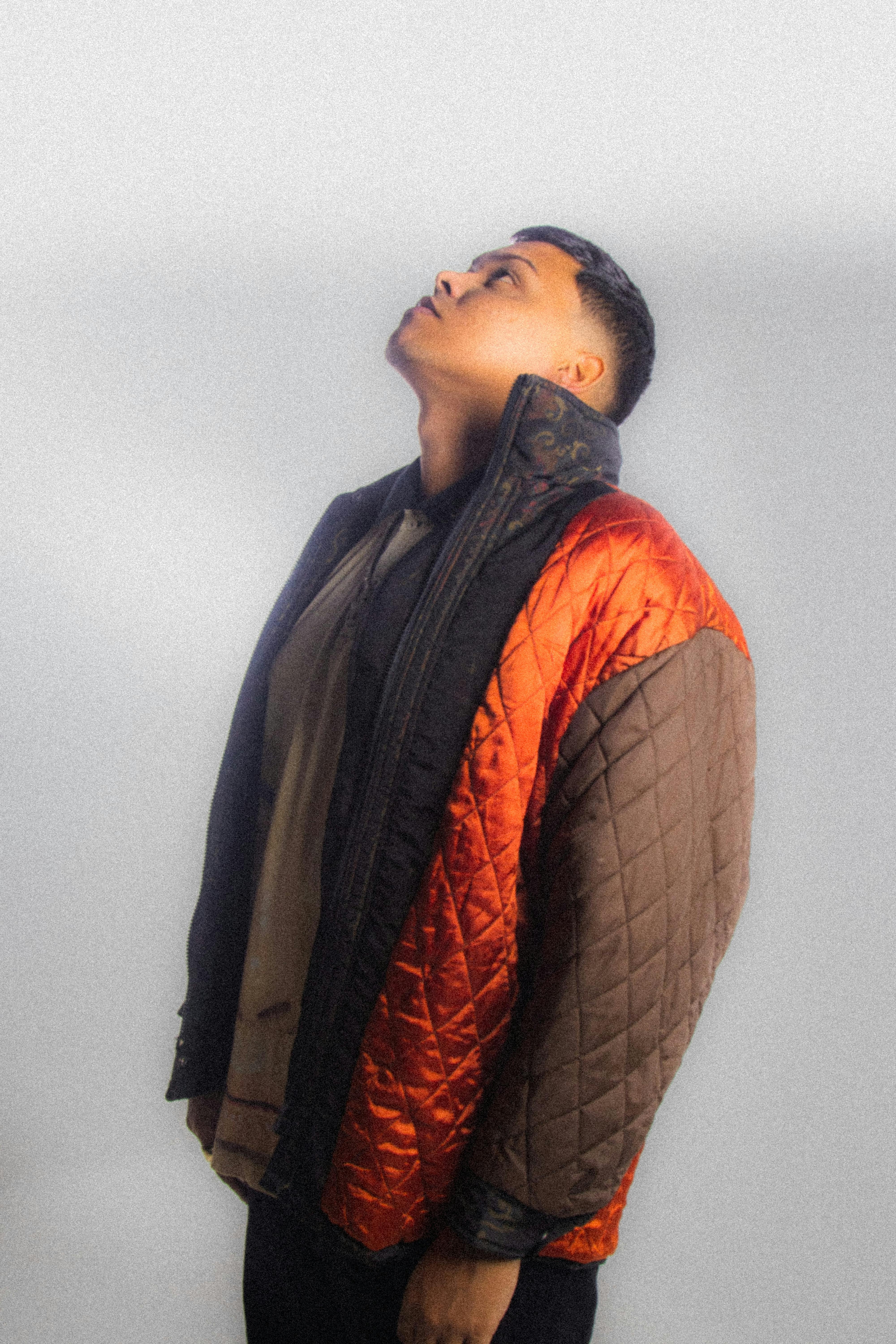 Man in a Jacket Standing and Looking Up · Free Stock Photo