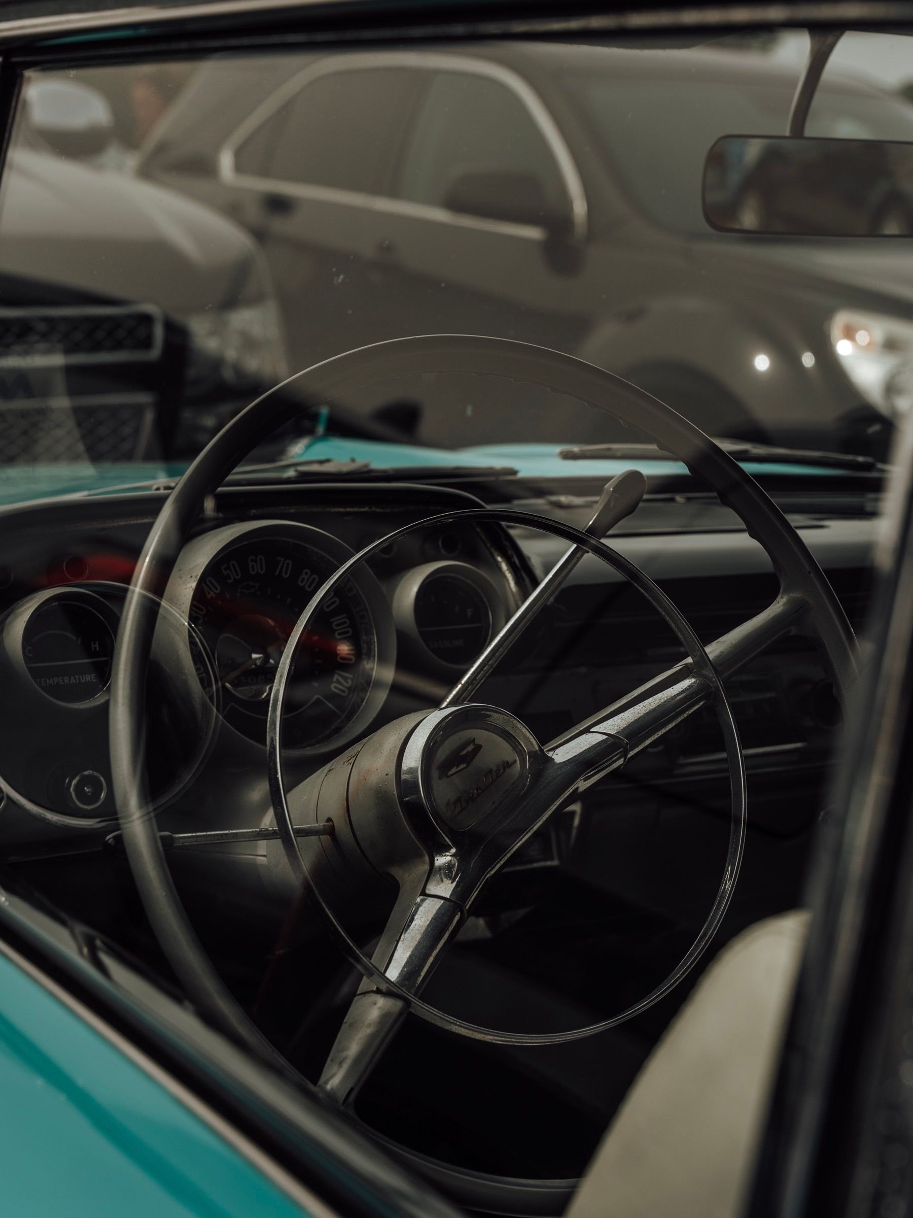 Steering Wheel behind Window of Vintage Car · Free Stock Photo