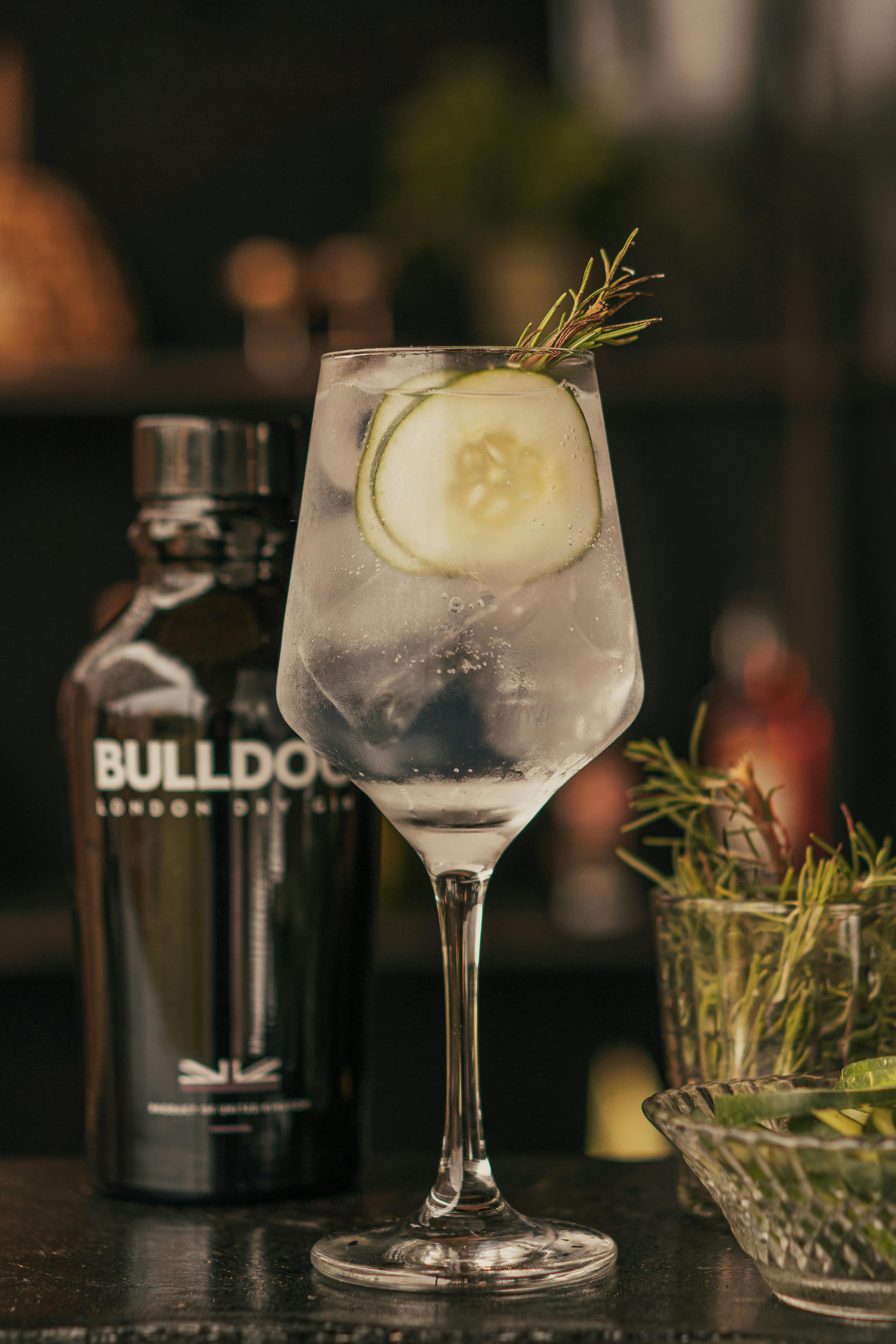 A Gin and Tonic Cocktail and a Bottle of Gin on the Bar Counter · Free ...