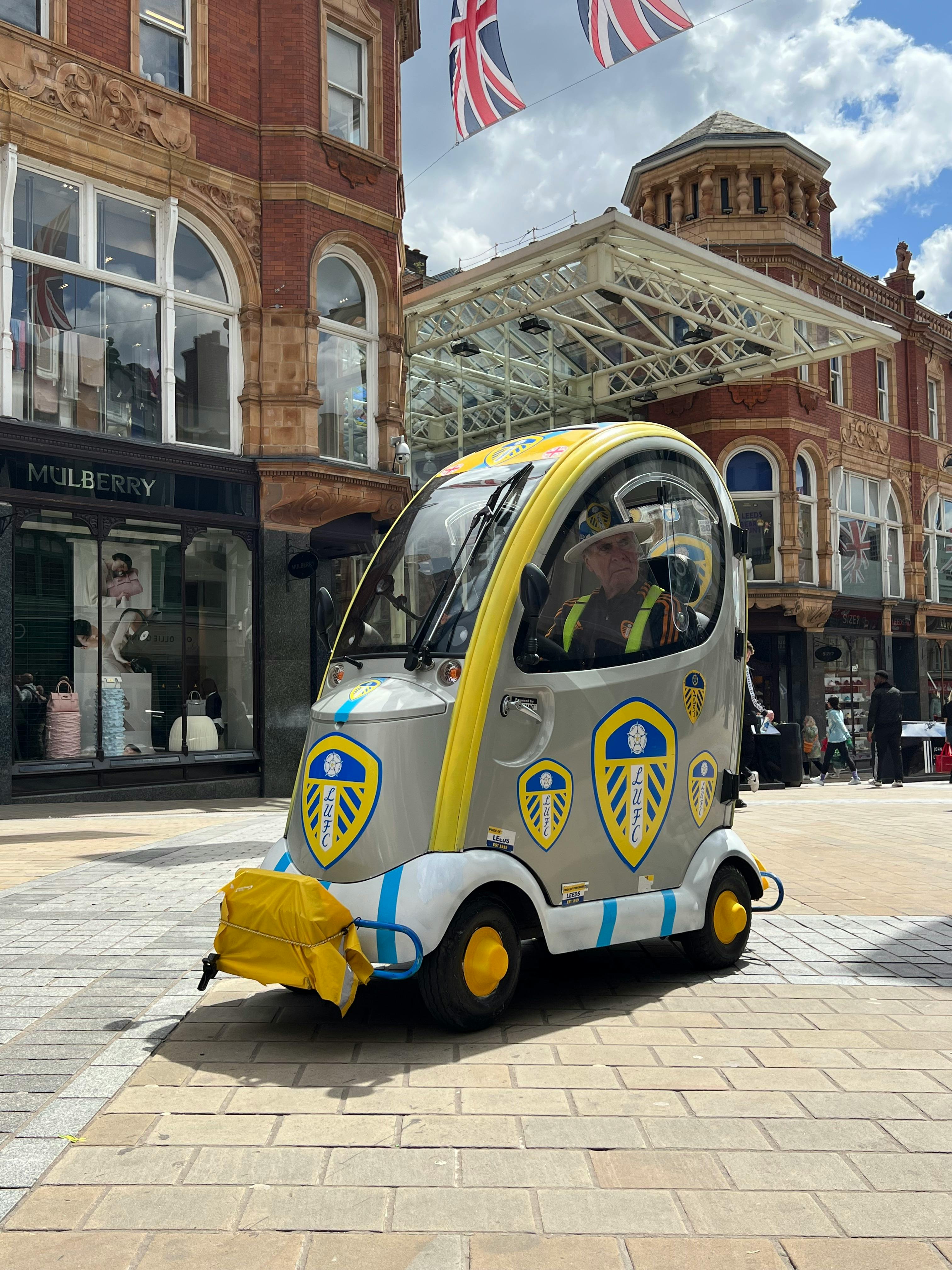 A Leeds United Fan Driving in a Custom Mini Car with the Football Club ...