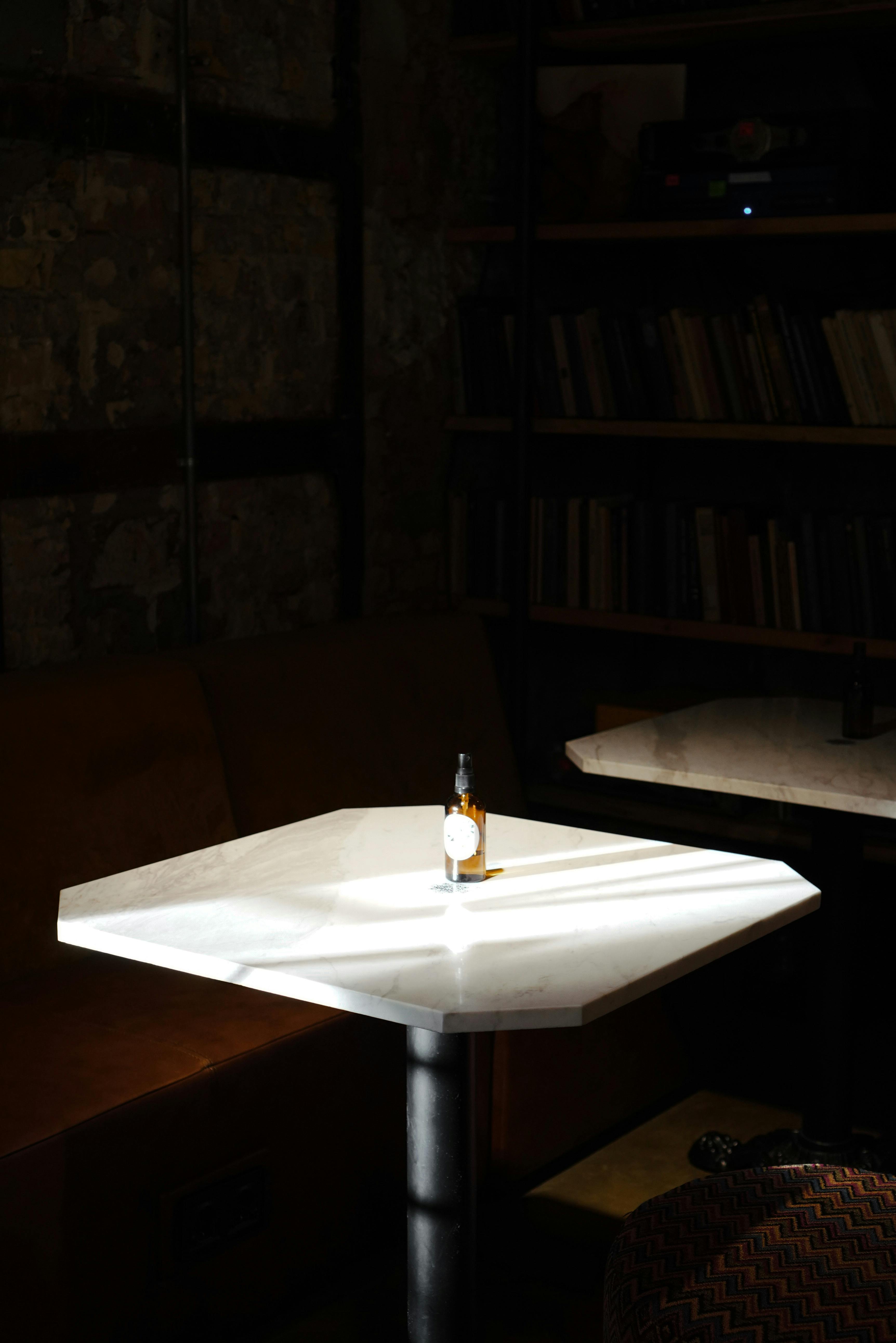 A Bottle on a Table in a Bar · Free Stock Photo